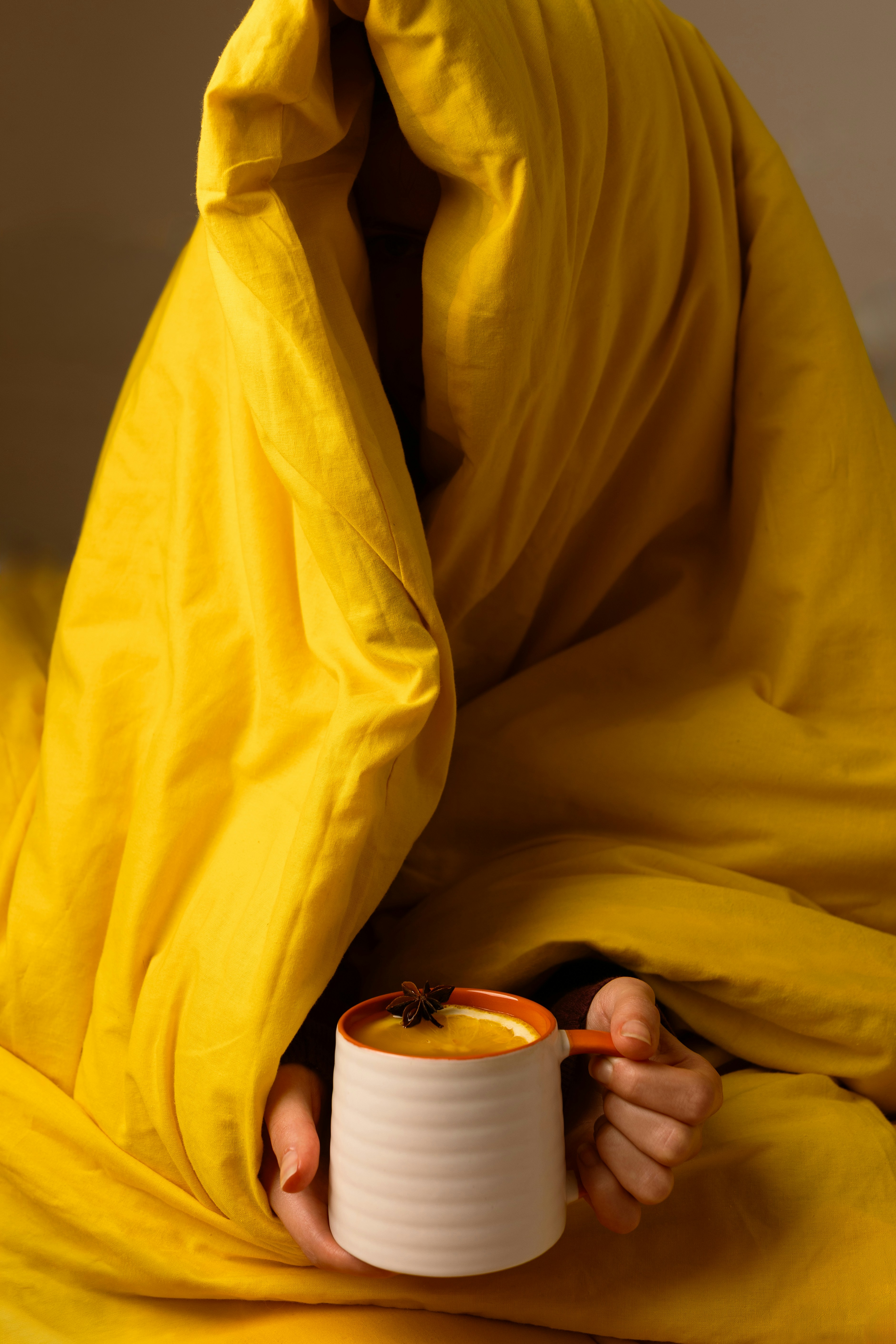 A Warm Embrace: Tea Hidden in Yellow Fabric