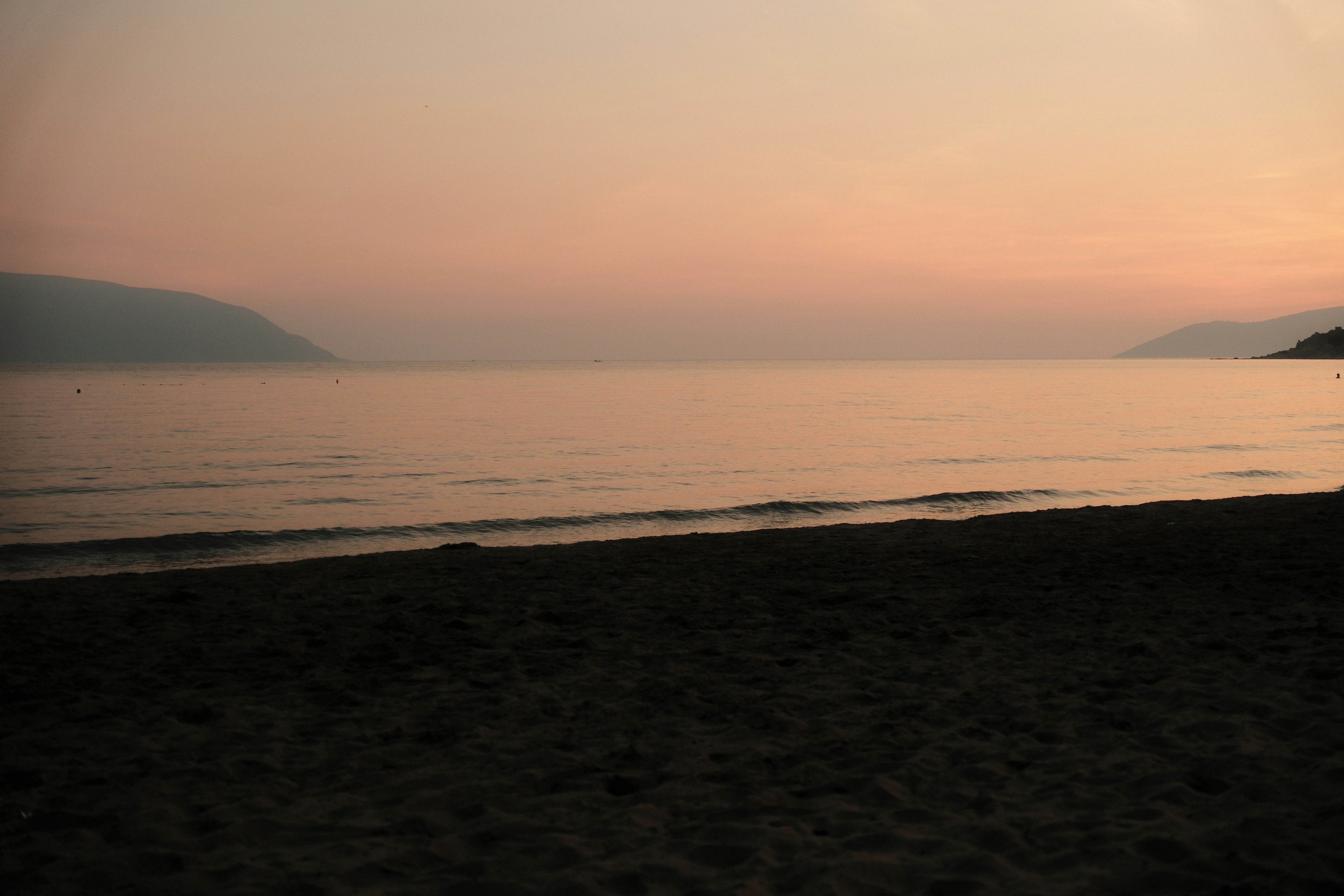 Hushed Horizon: A Dusk-Soft Beach Embrace