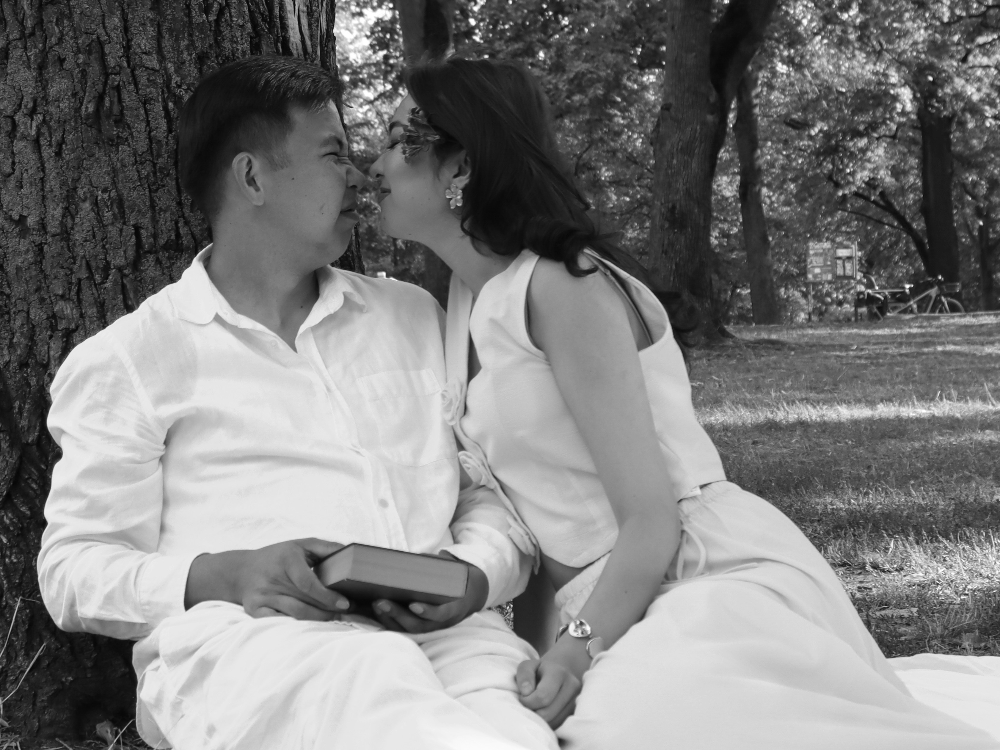 Close-quiet Bond: Couple Resting under a Park Tree