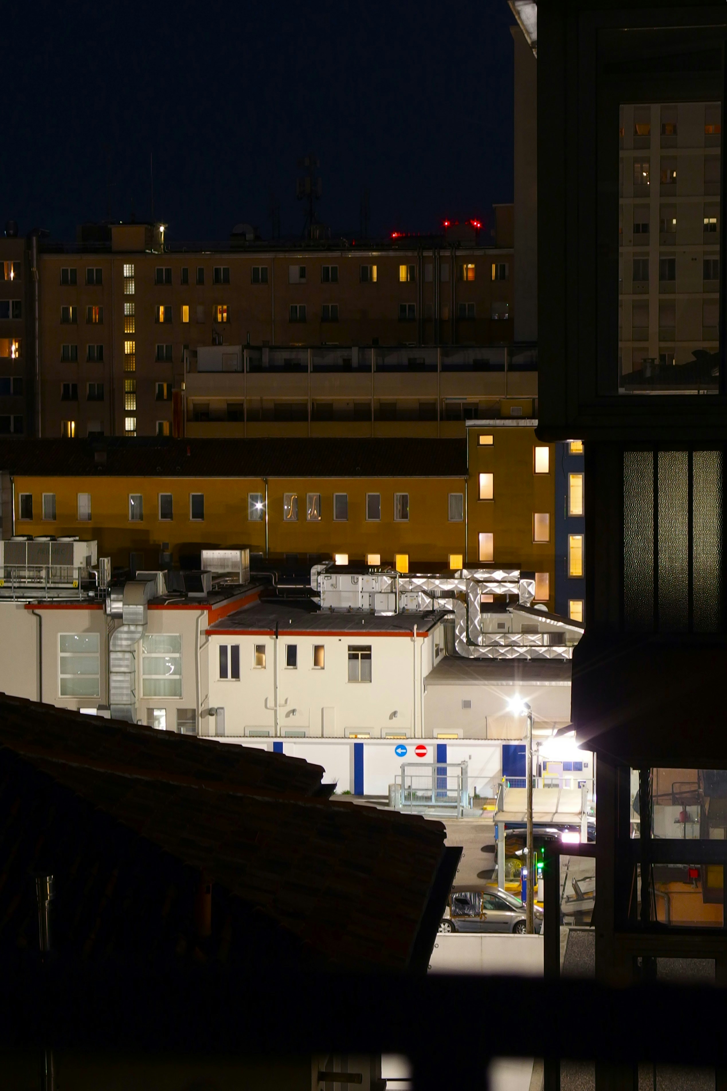 Night City Loft: A Neon-Outlined Studio Overlooking Industrial Alley
