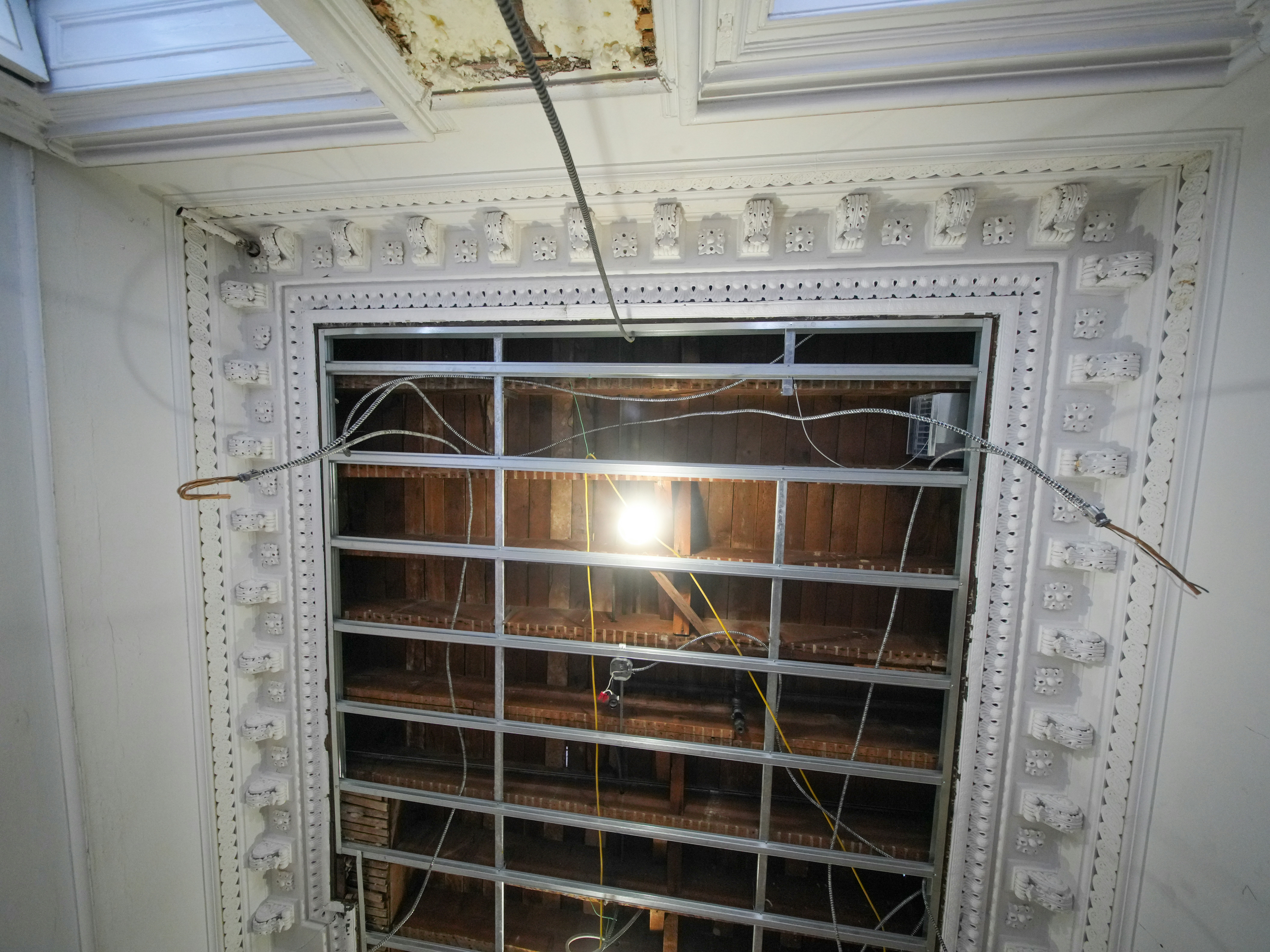 Ceiling Grate and Wiring: Industrial Light in an Abandoned Room