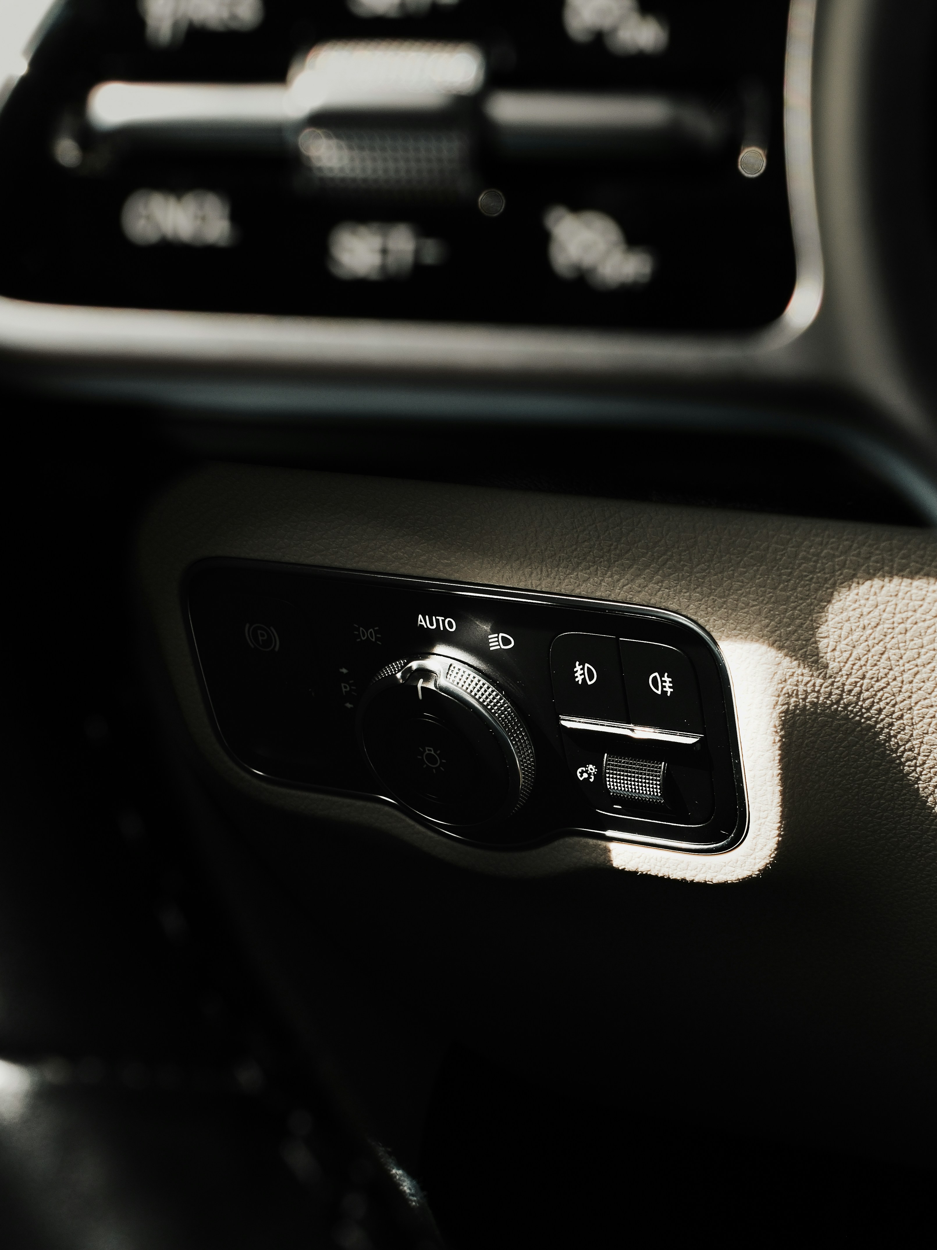 Touch of Control: Steering Wheel Panel and Dial on Soft-Toned Interior