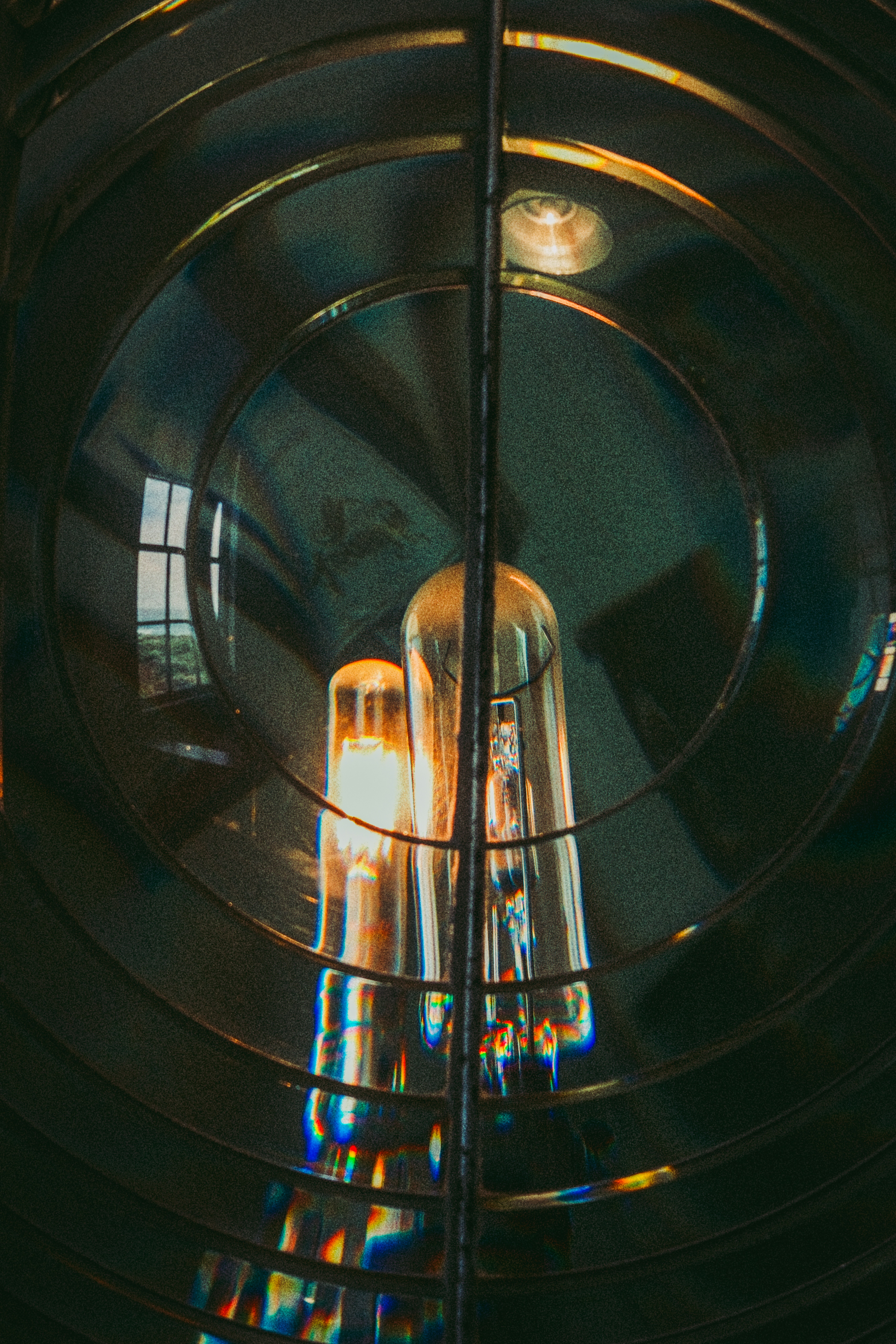 Iridescent Filament through a Lens Grill