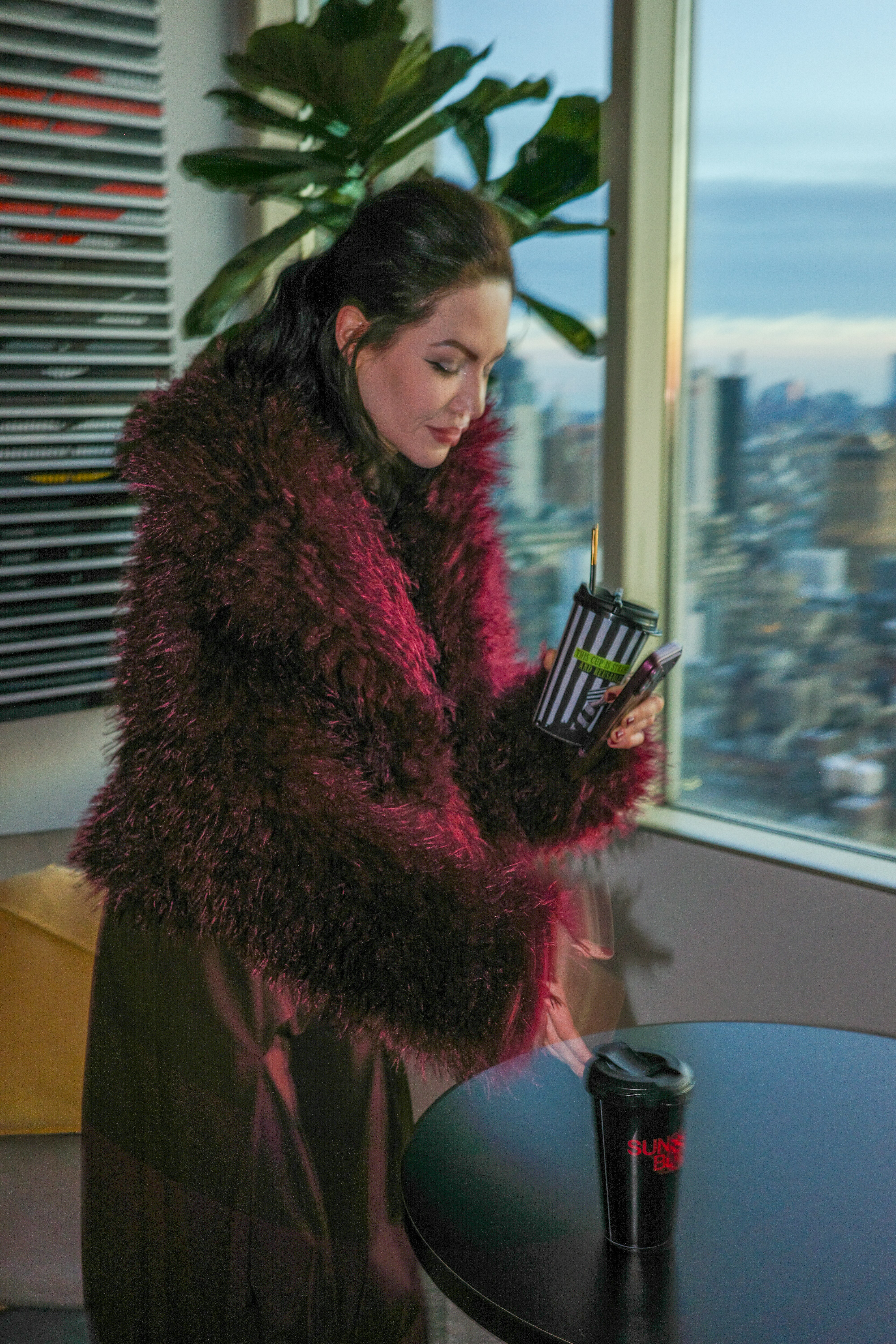 Urban Cozy: A Fashionable Moment by the Window