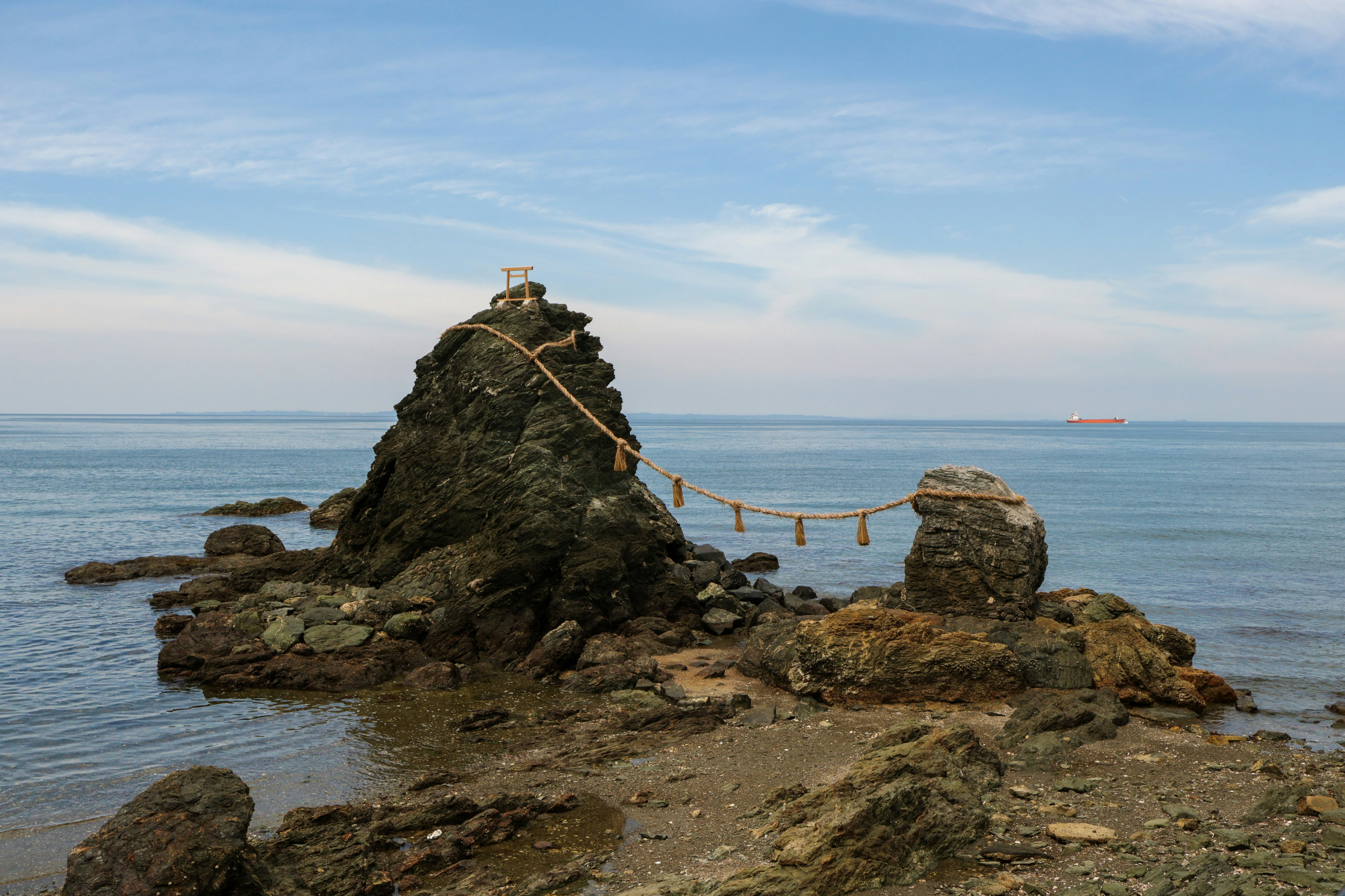 Sacred Rock Staircase: A Rope-guarded Shimenawa Perched by the Sea