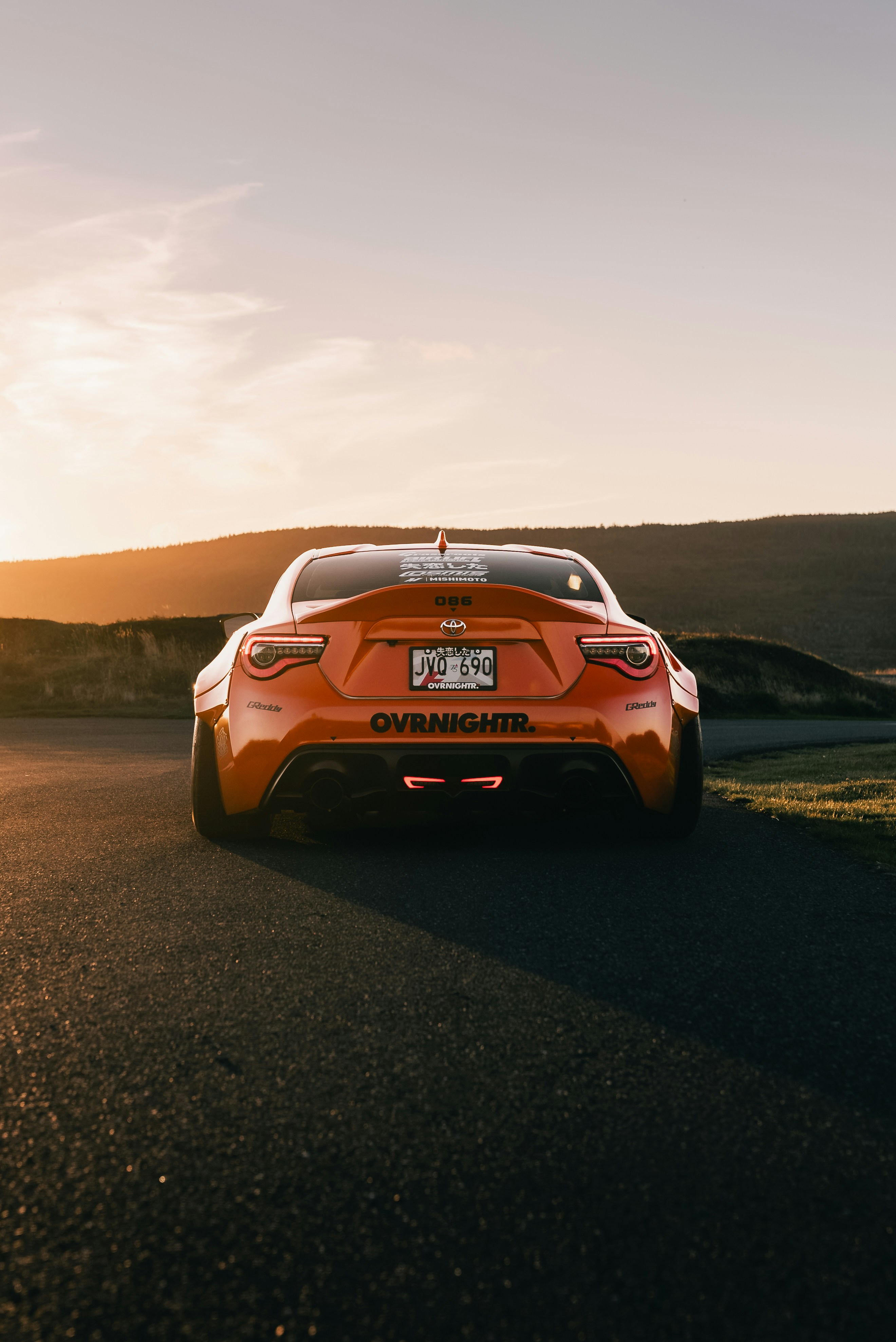 Sun-Glazed Turn: The Orange Racer from the Horizon
