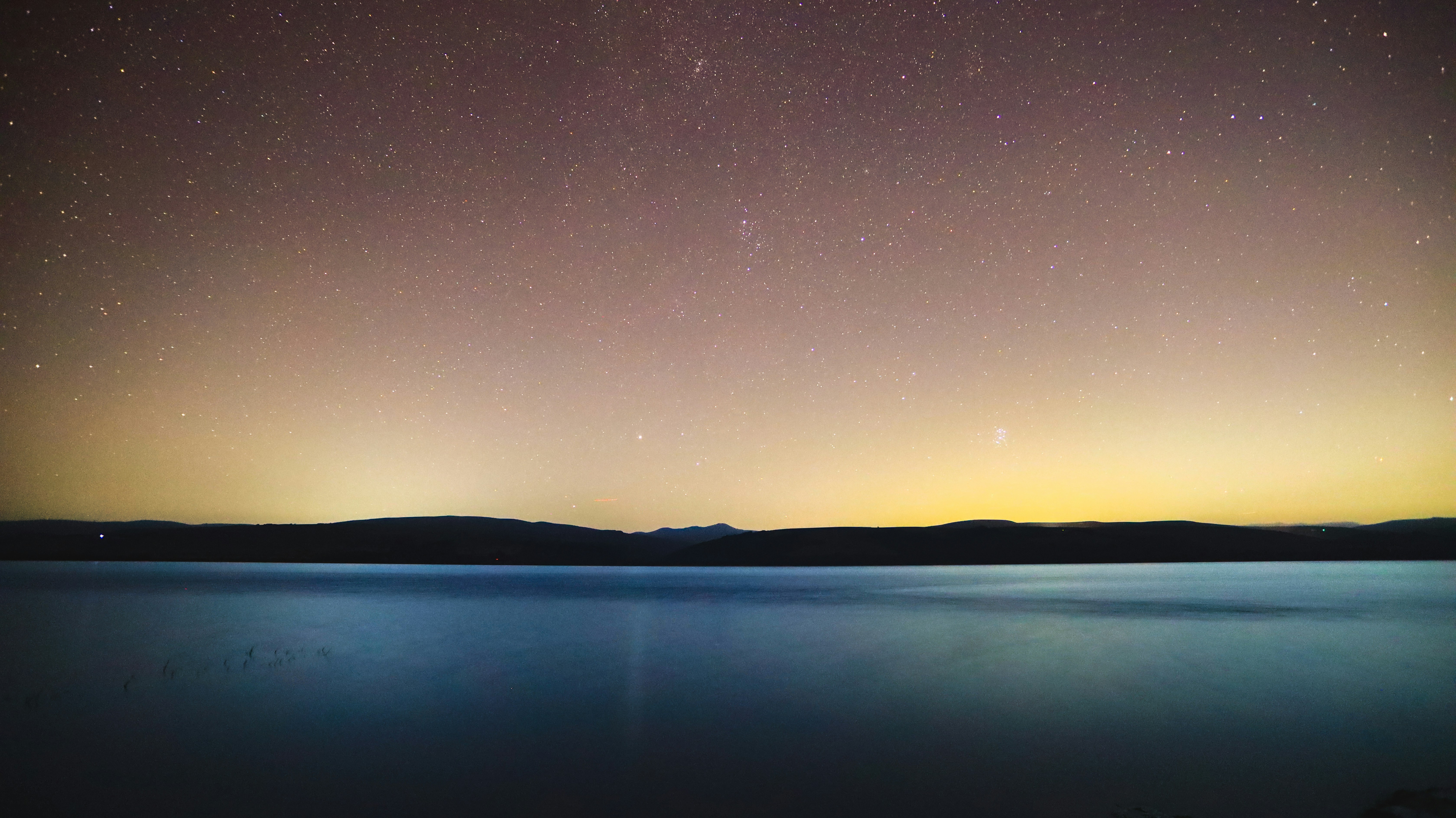 Silent Horizon: A Night Sky Over Quiet Waters