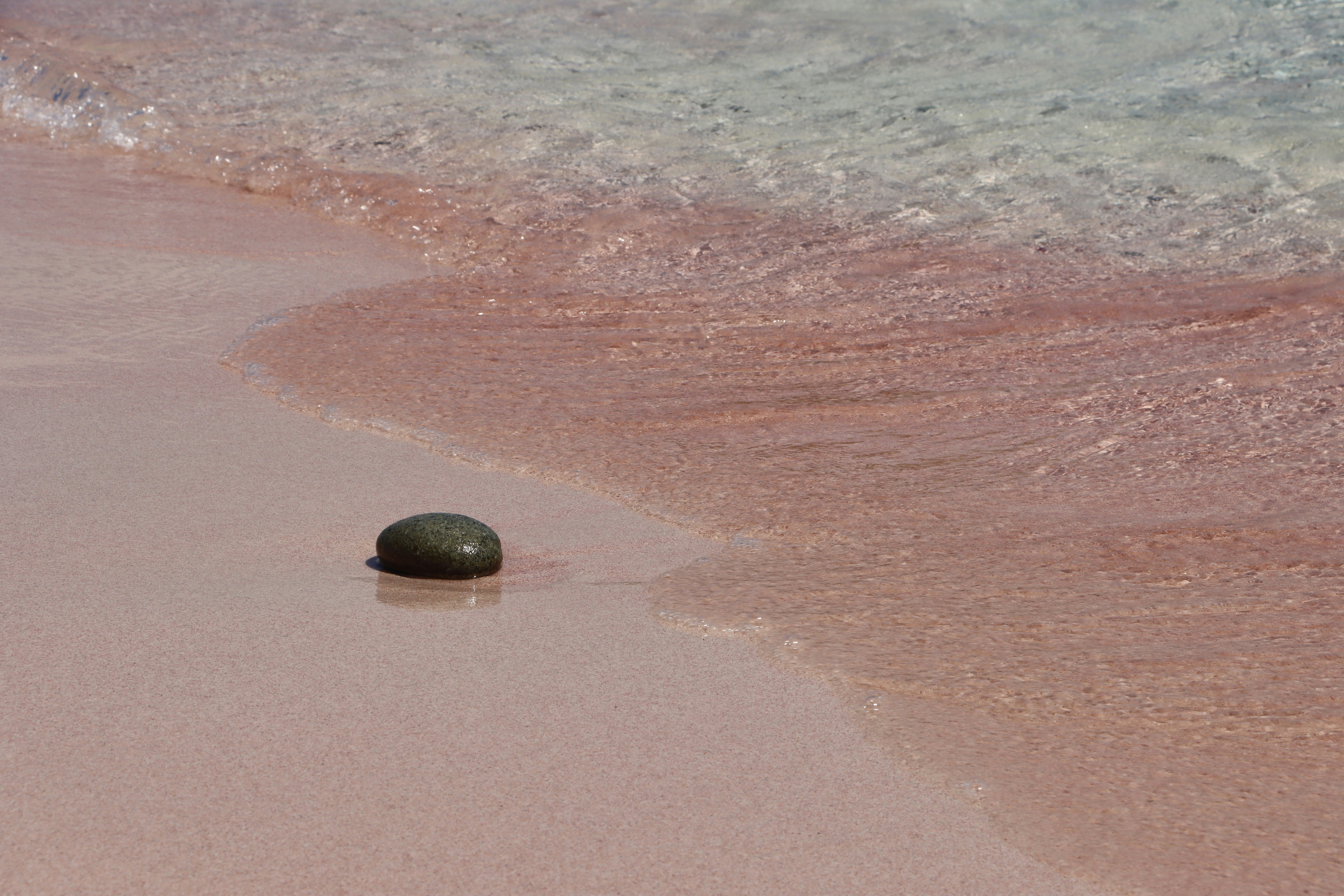 Pebble Sentinel on a Quiet Pink Shore