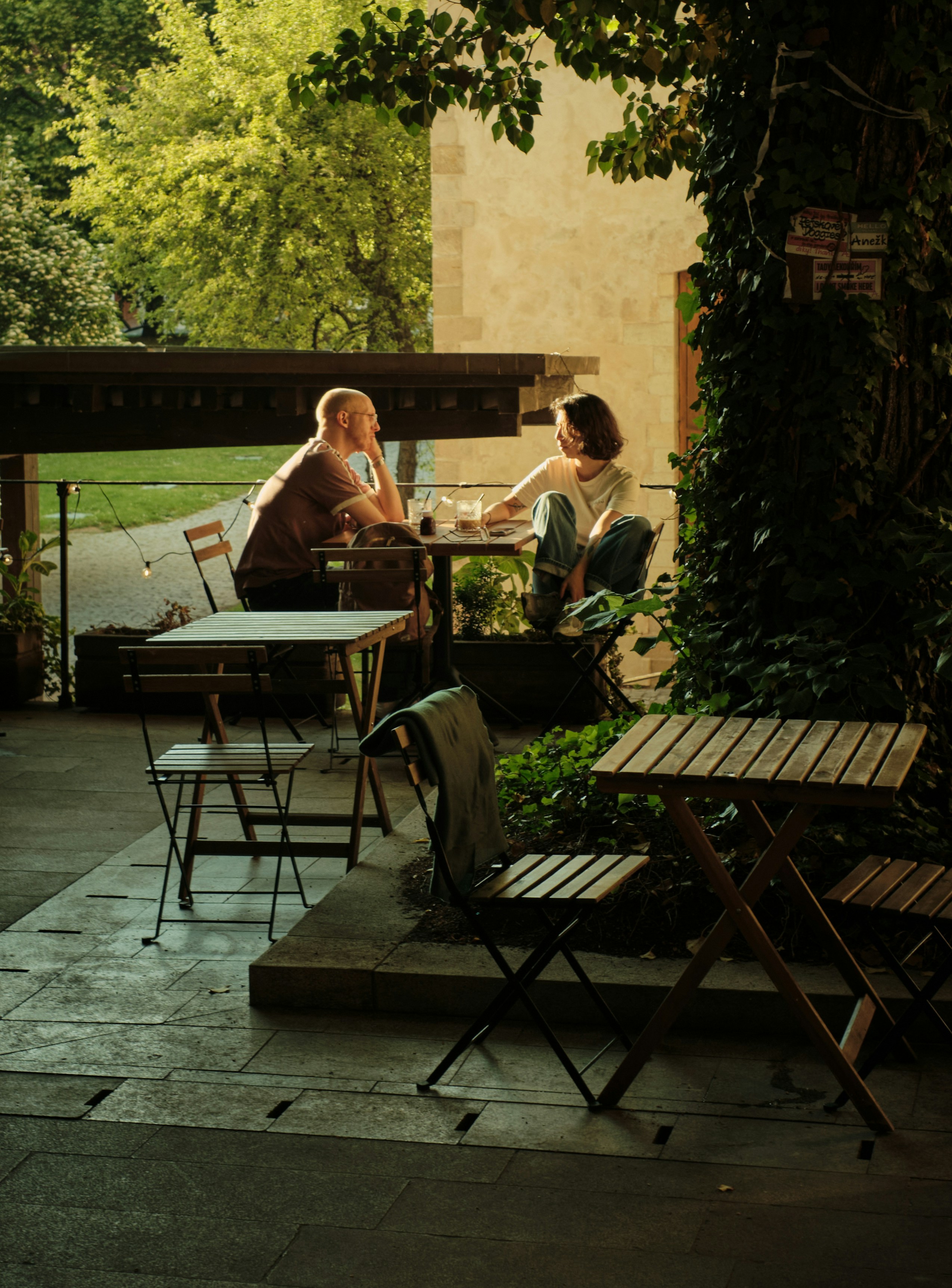 Evening Conversation by the Canal Café