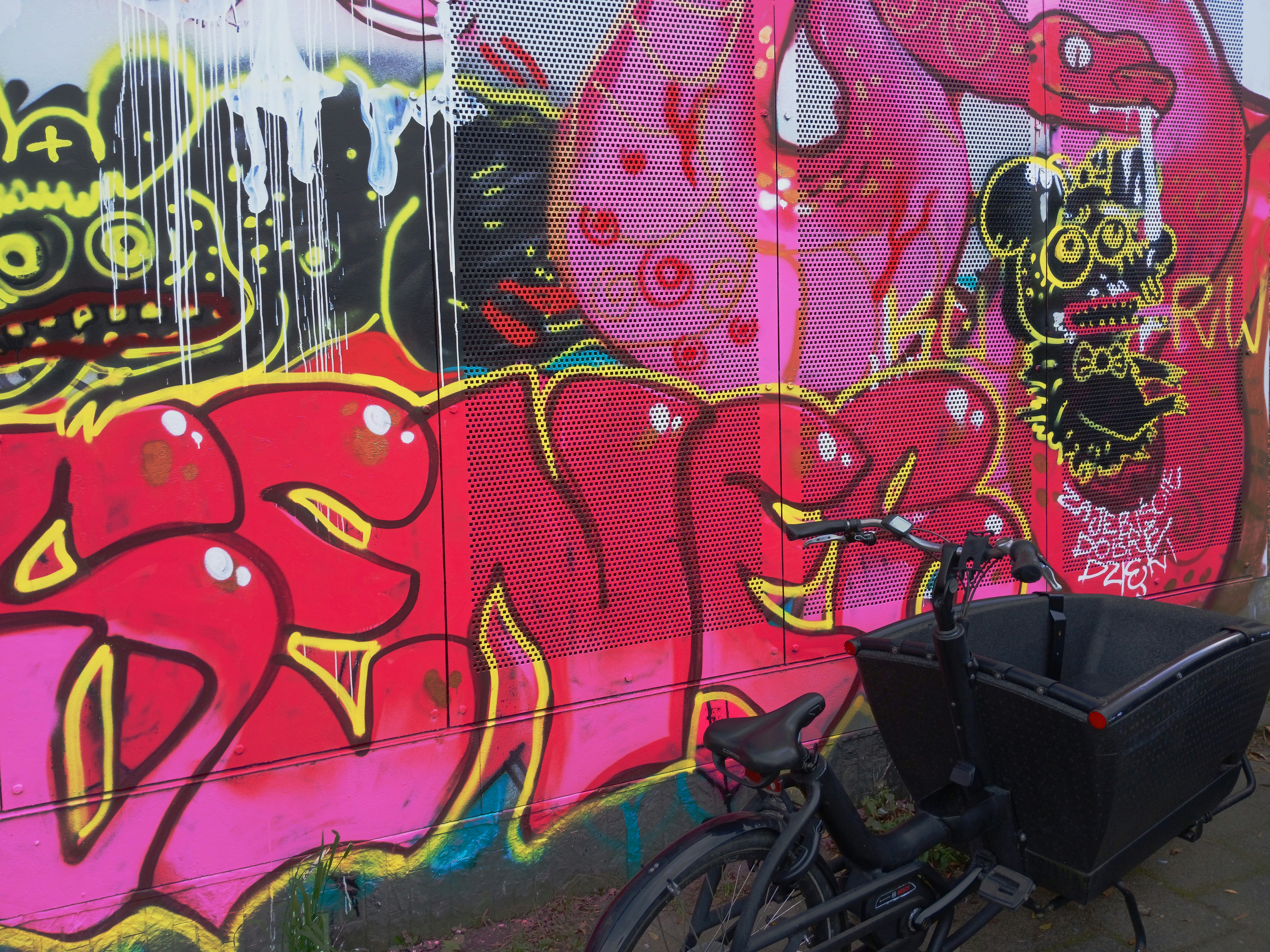 Vibrant Graffiti Scene Framed by a Cargo Bike
