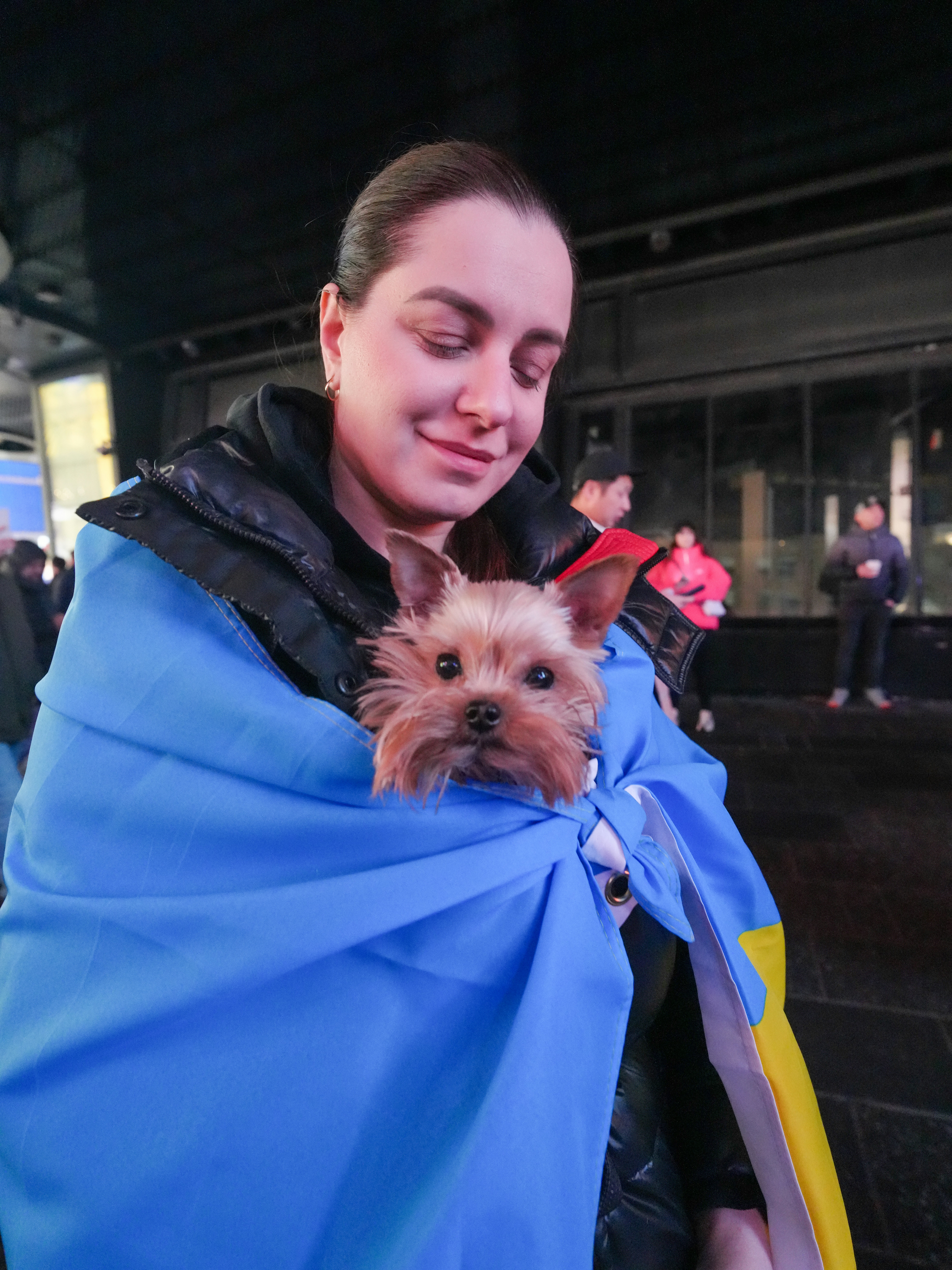 Blue Shelter: A Woman and Her Poppin’ Pup in an Urban Glow