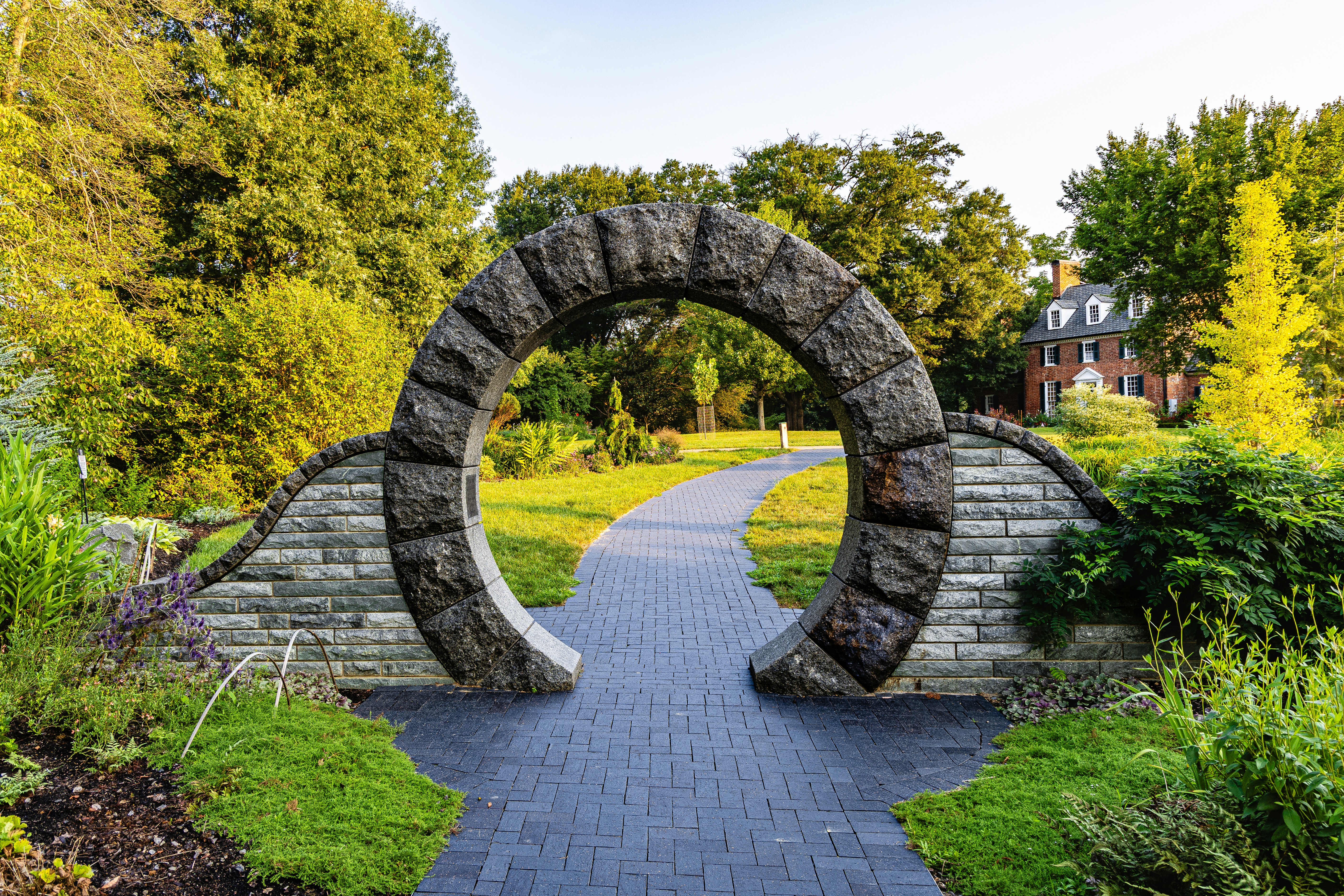 Stone Ring Portal: A Serene Pathway Framed by Arch and Garden