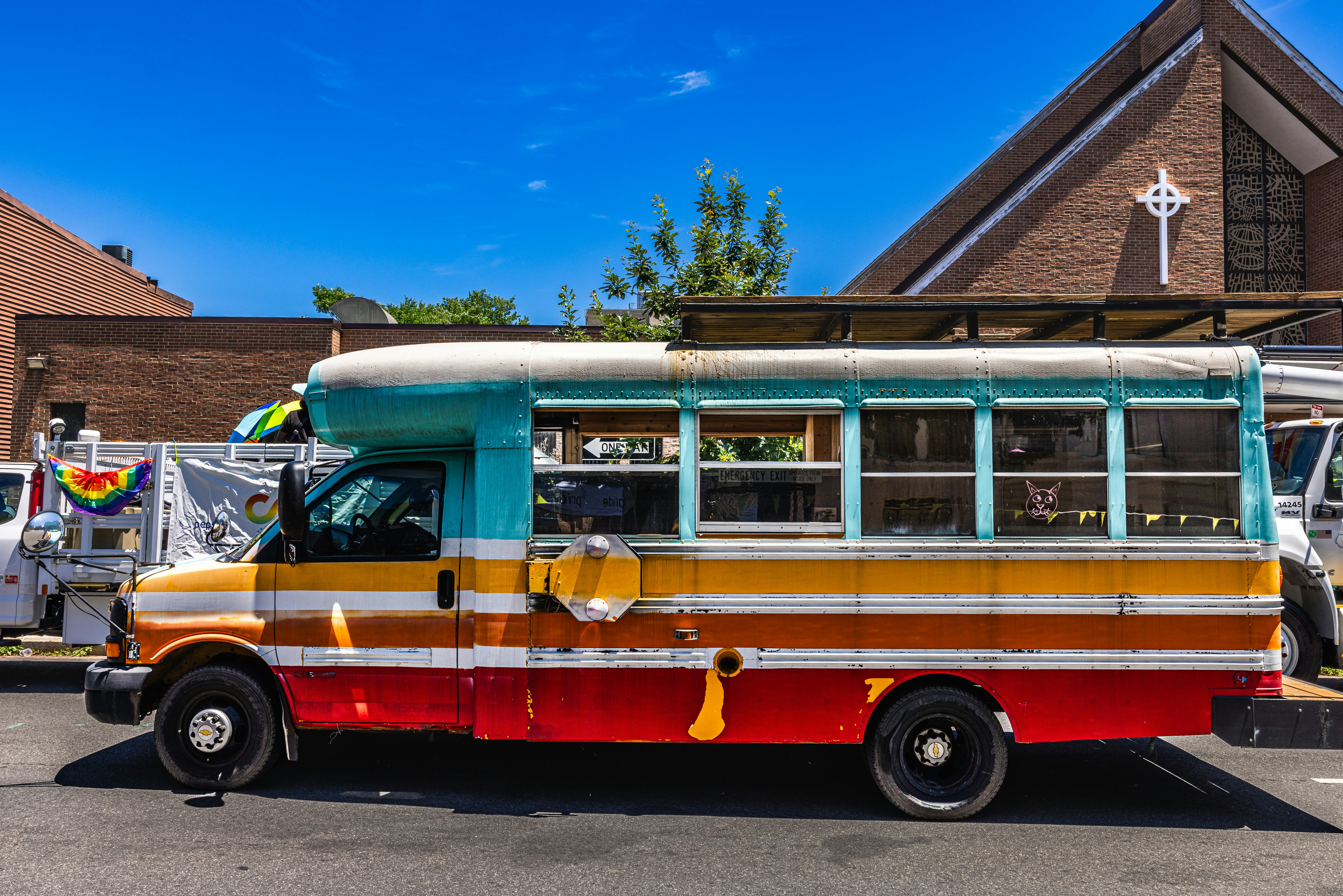 Sunlit Rainbow Bus at the Community Hub