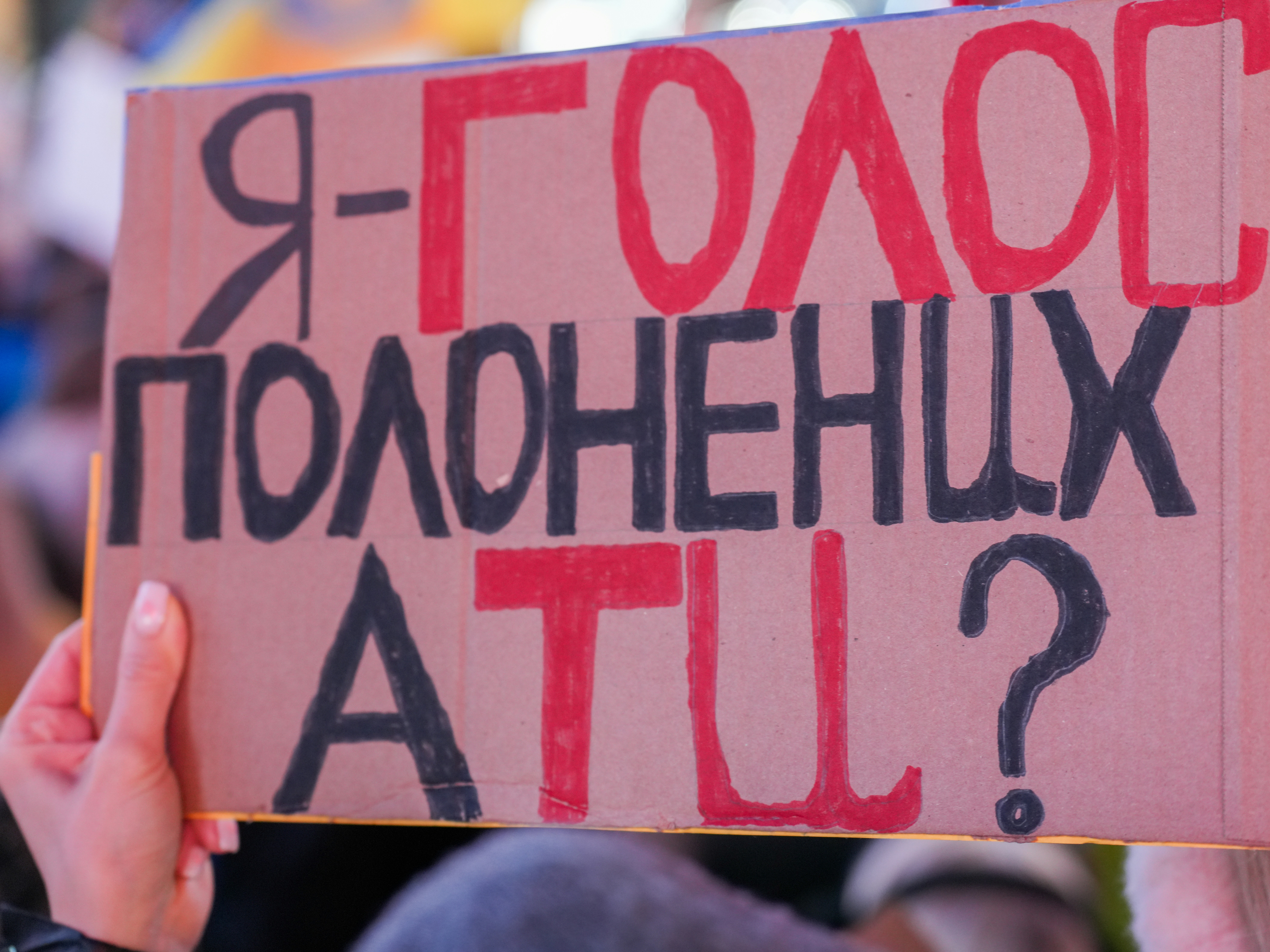 Hands Raised, Cardboard Voices: A Sign of Silent Solidarity
