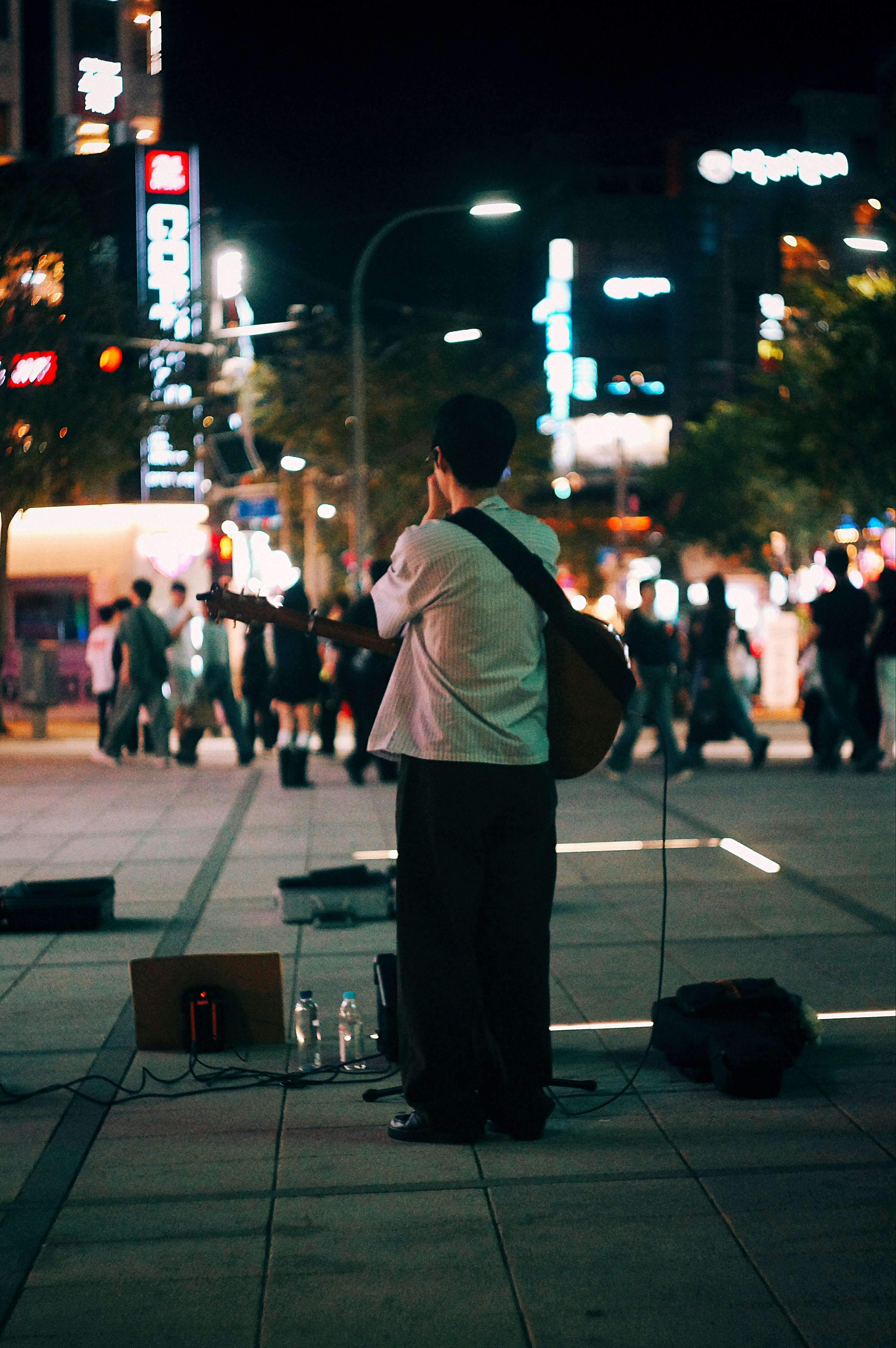 Midnight Street Busker: Guitarist Under Neon Skies