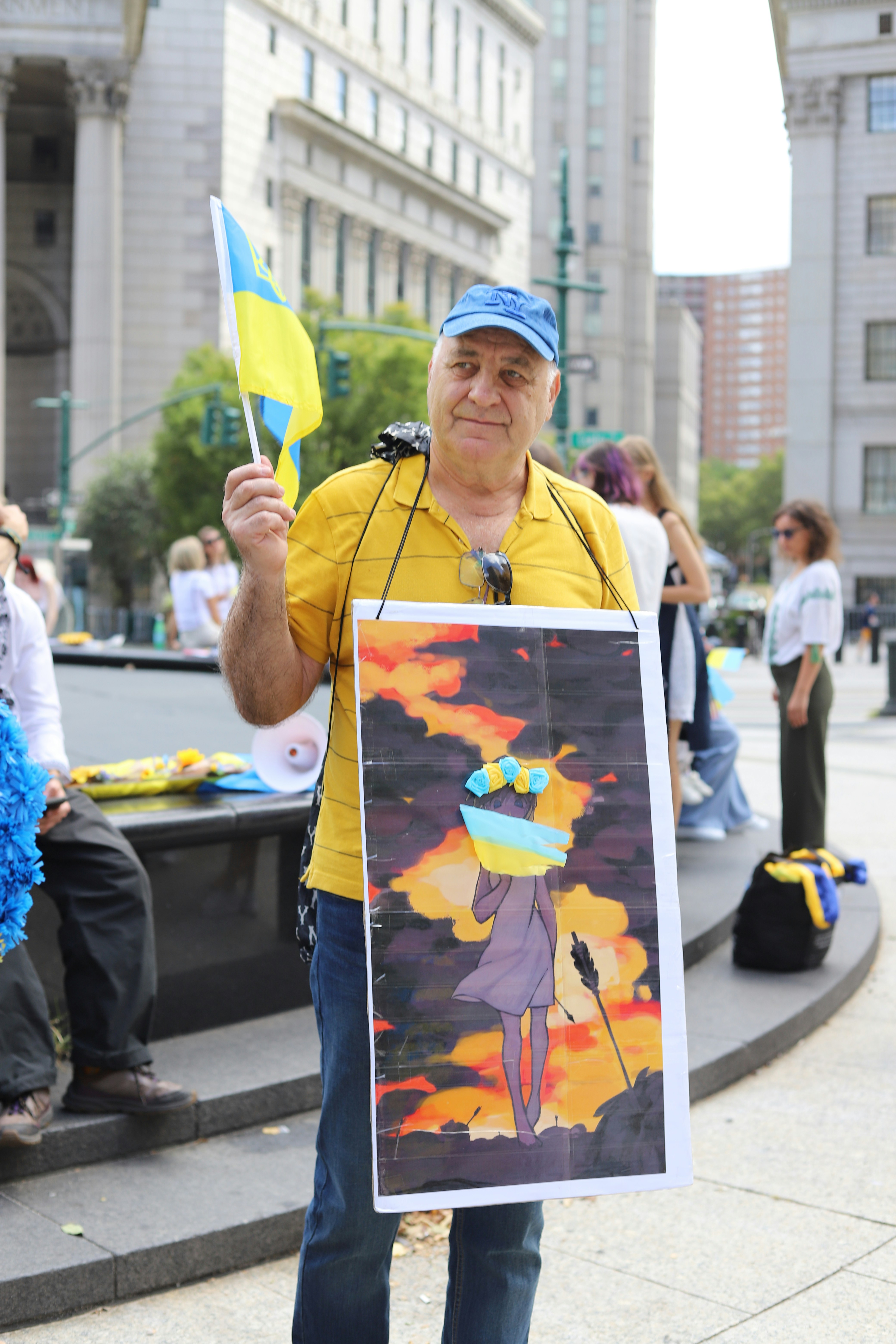 Flag Waver with Poster: A Street Portrait of a Disability of Light