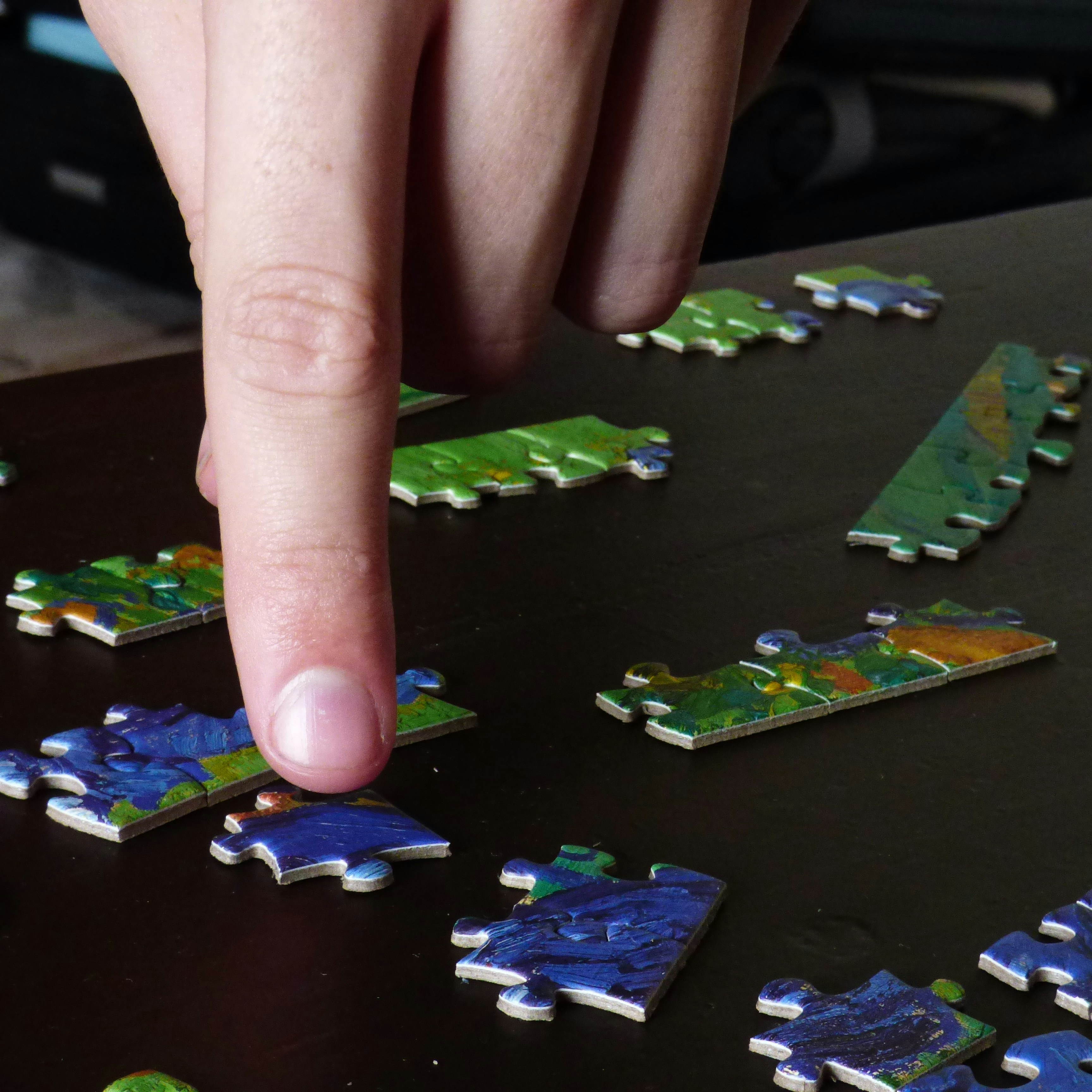 Puzzle Pieces under a Delicate Fingertip