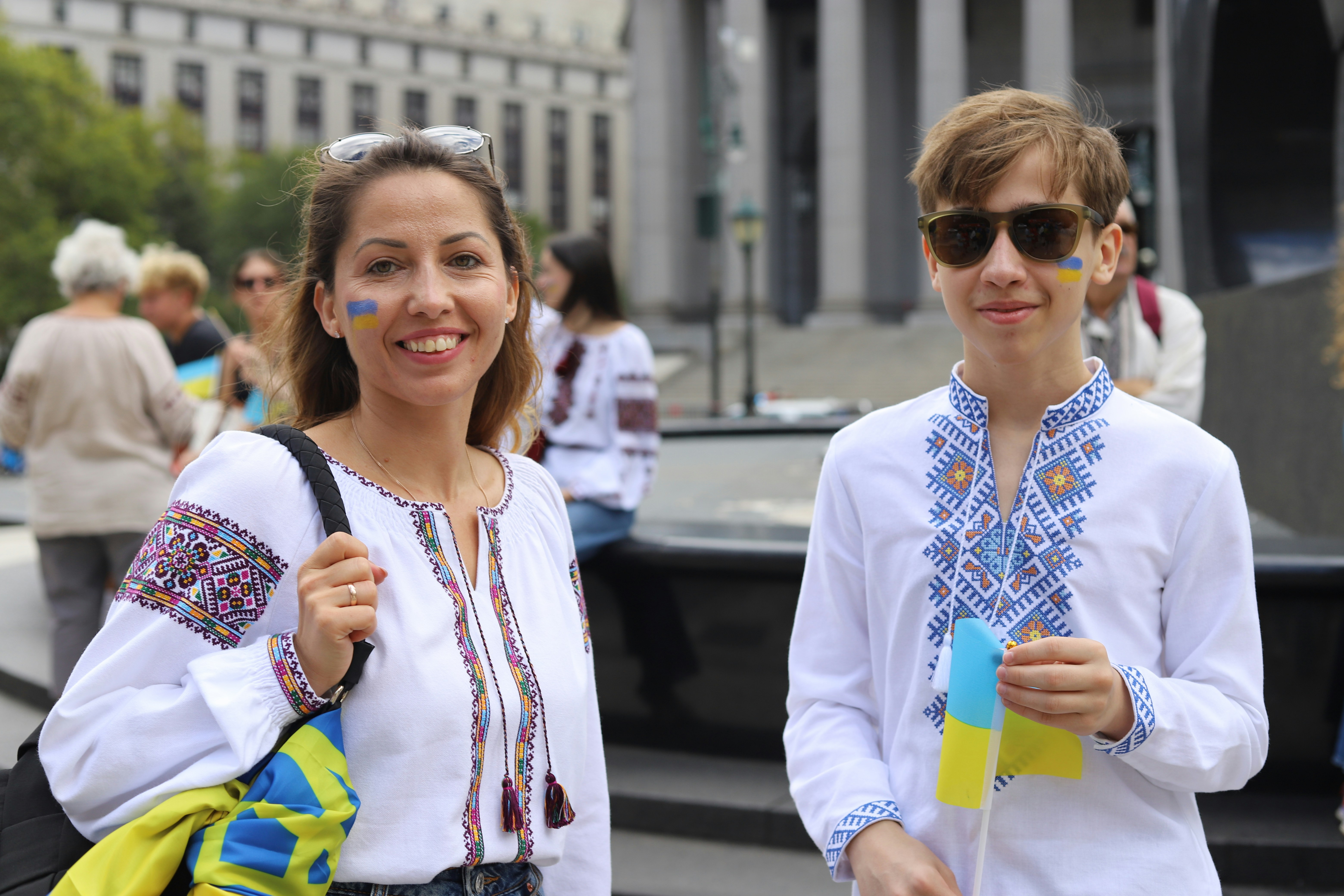 Two Ukrainian-Flag Enthusiasts in Traditional White Embroidered Shirts