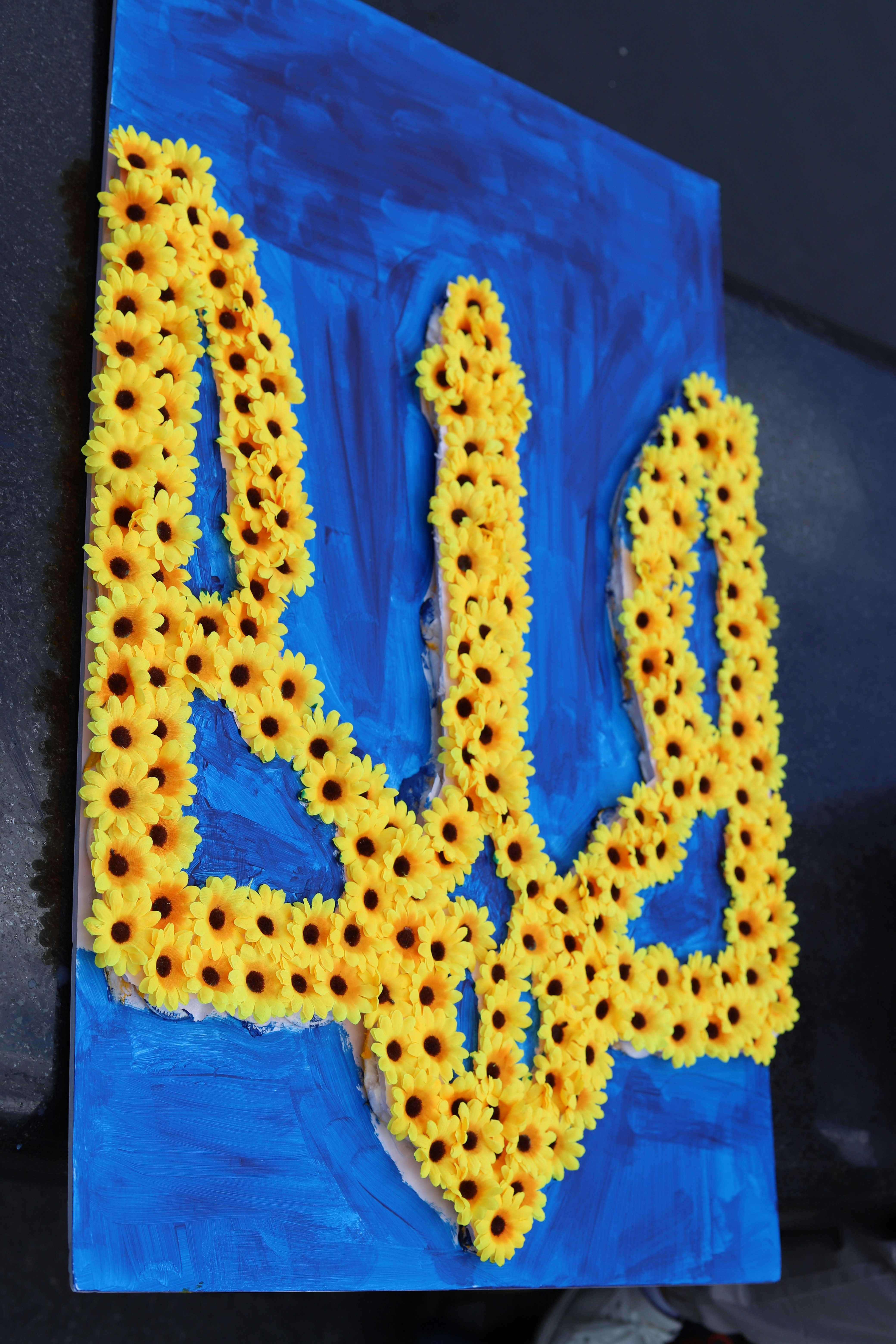 Sunflower Border Mosaic: Yellow Florals Form a Blue Canvas