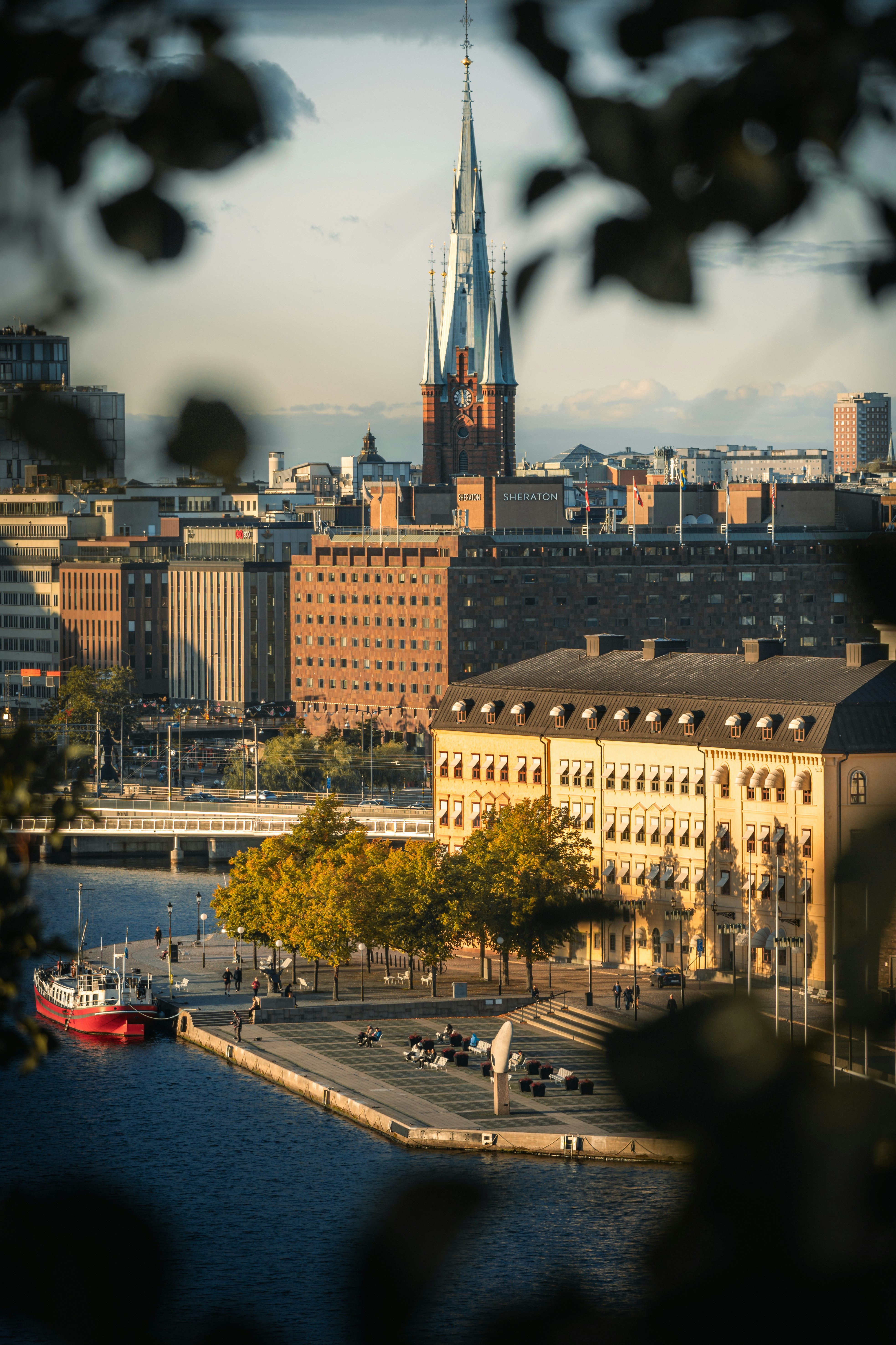 City Cathedral in Focus: Spires and Riverside from a Framed View