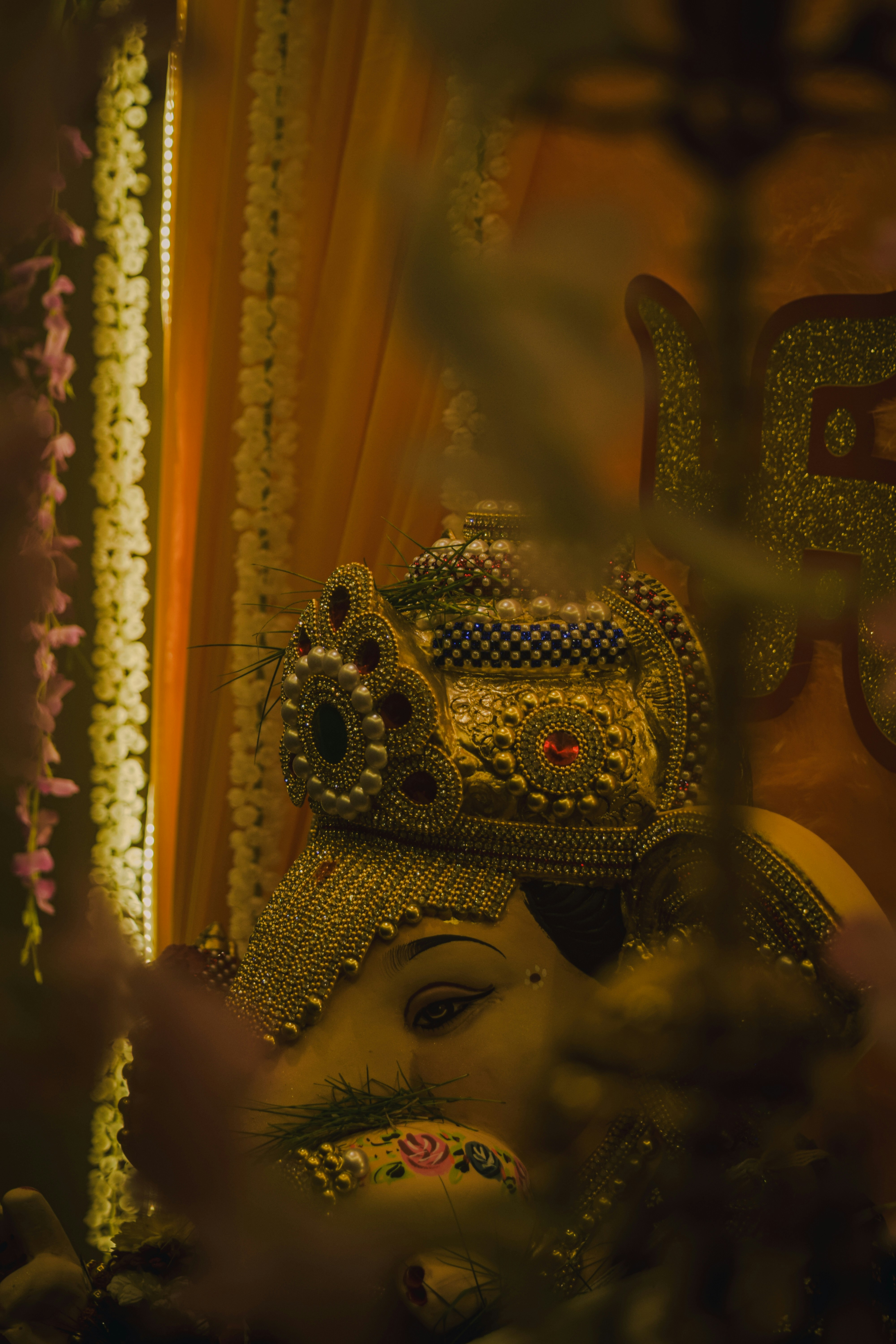 Ornate Ganesh Adornments Under Warm Festival Light