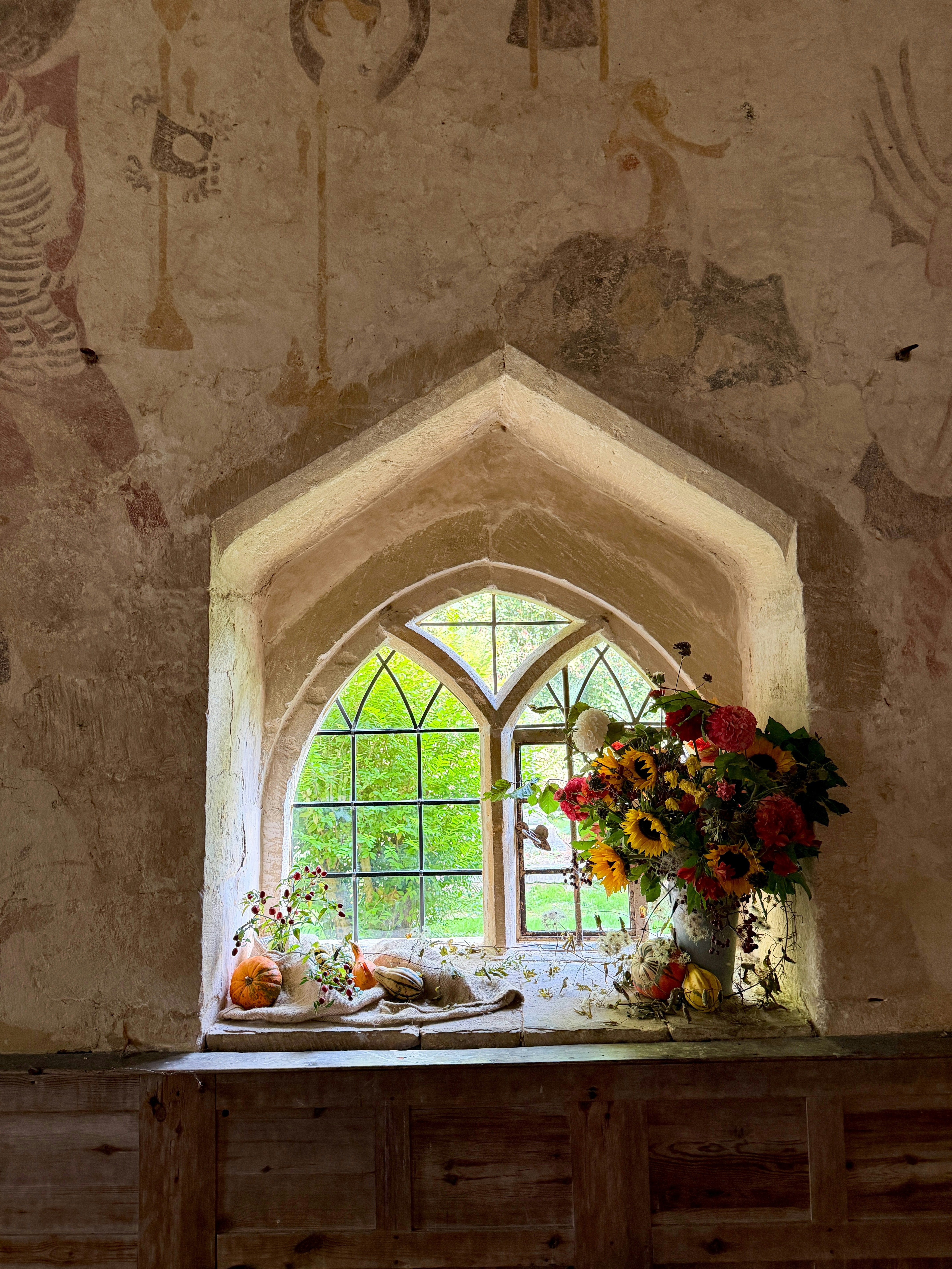 Sunlit Arched Window with Autumnal Bouquet