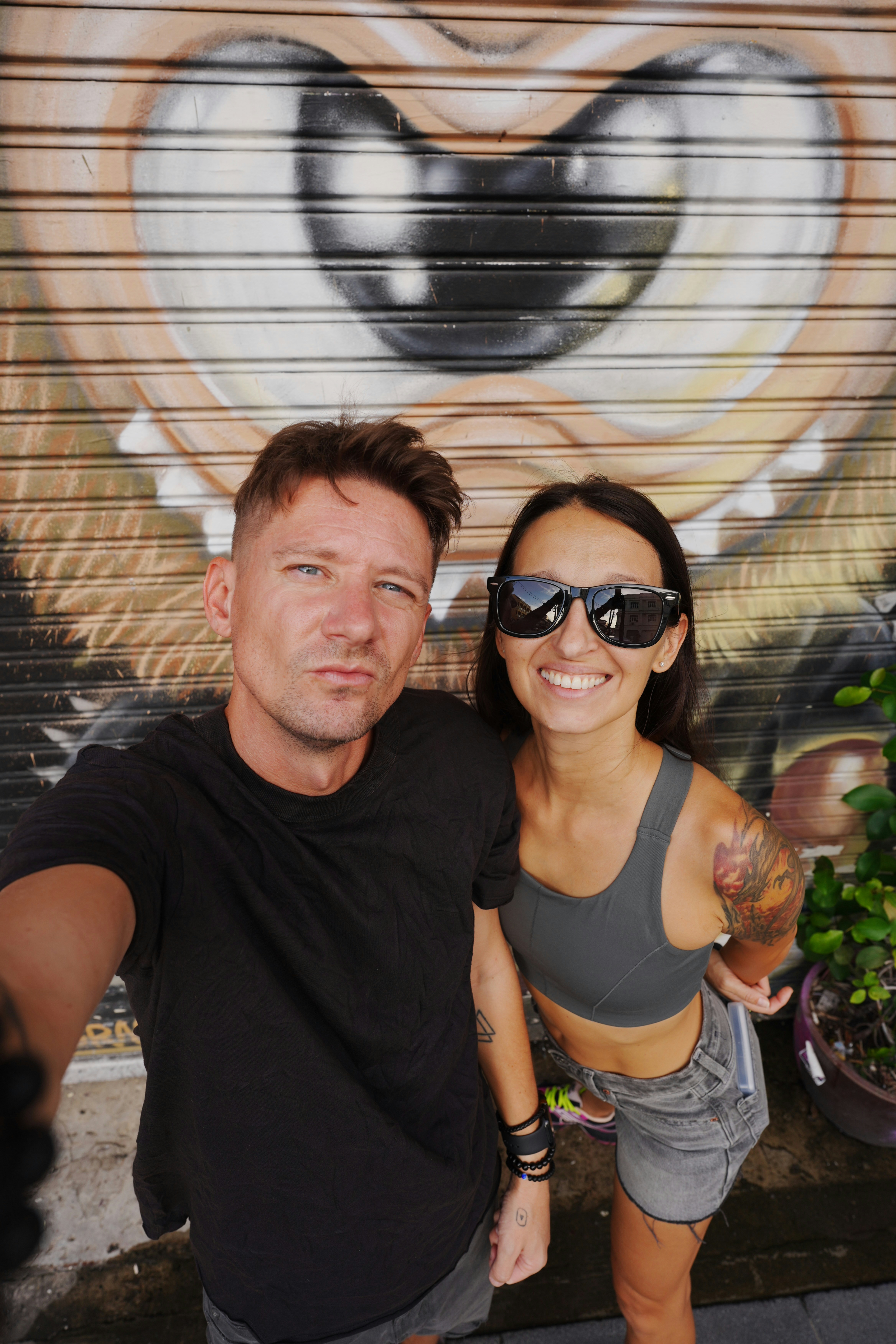 Two Friends in Front of a Bold Graffiti Heart