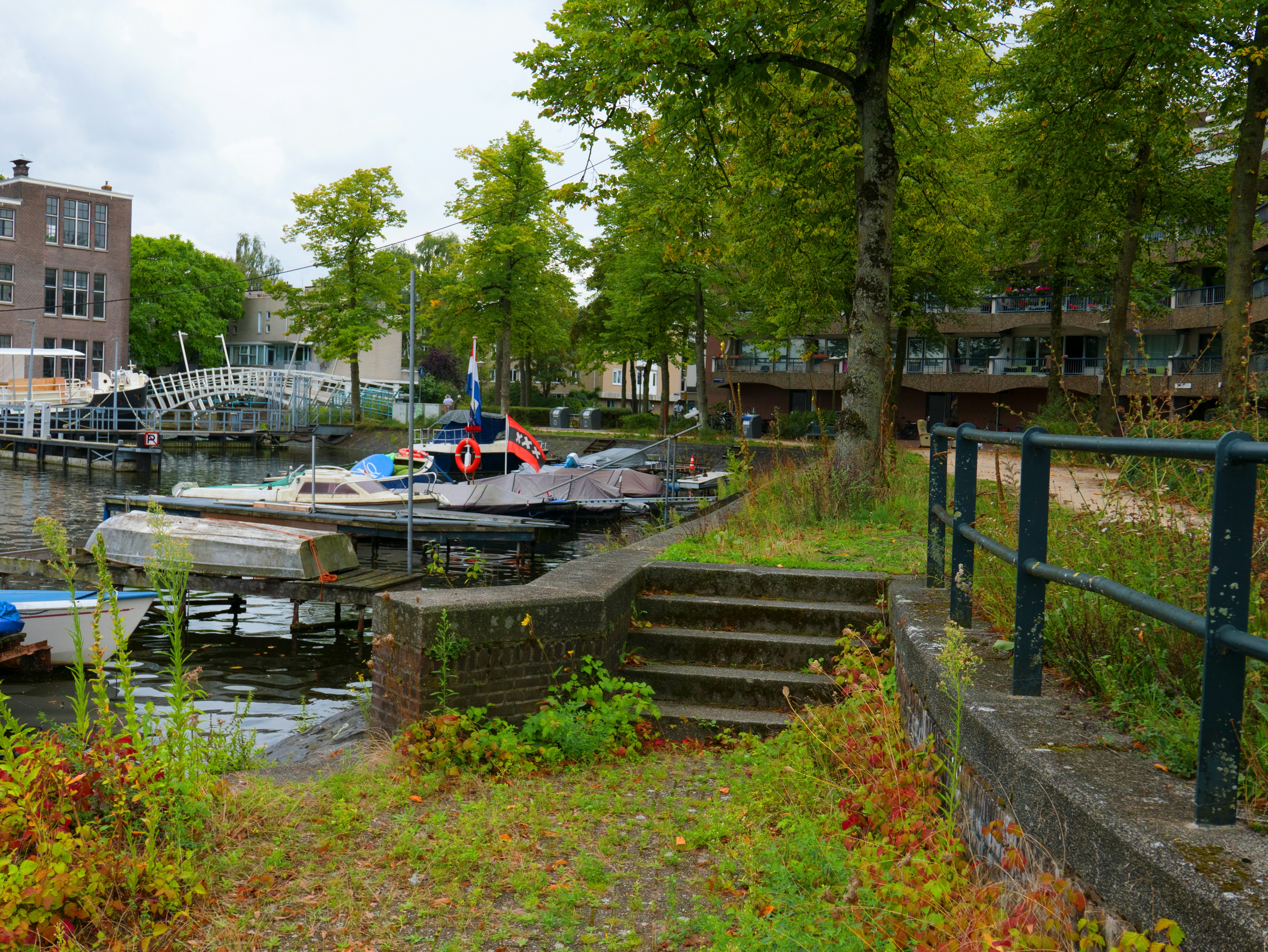 Quiet Canal Corner with Boats and Greenery