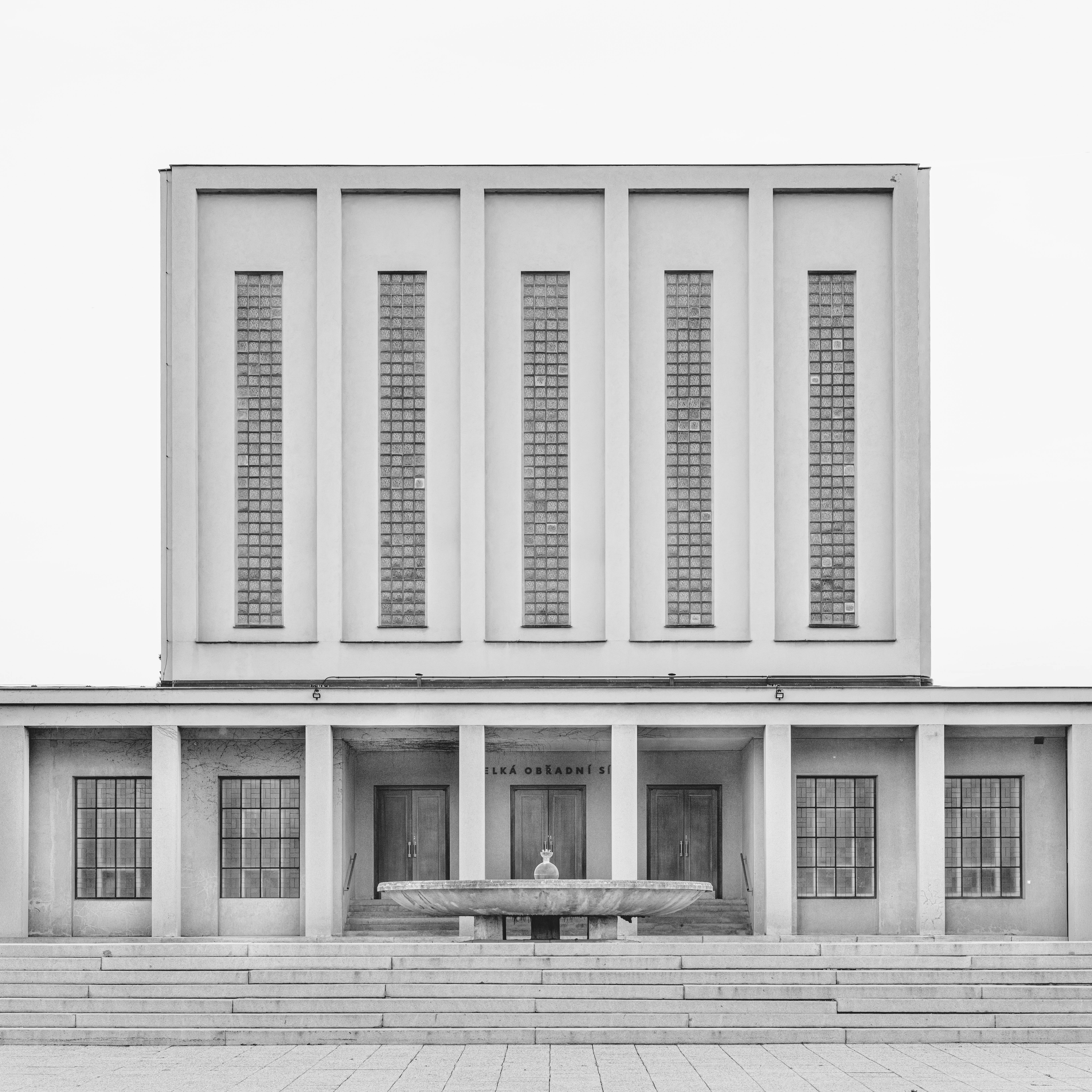 Monolithic Facade: A Quiet Monument Between Steps and Windows