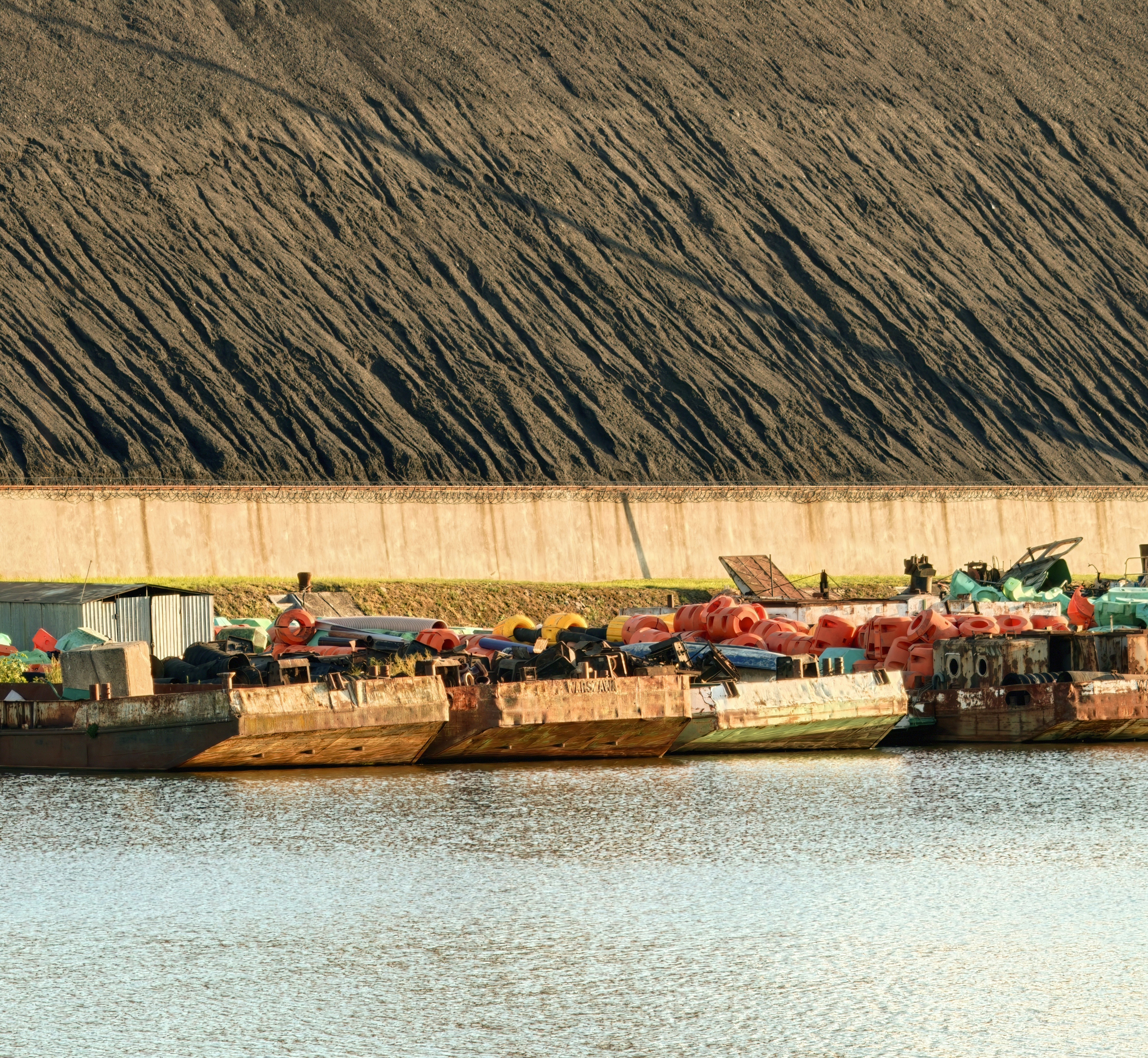 Harbor of Painted Boats by the Dune-Walled Shore