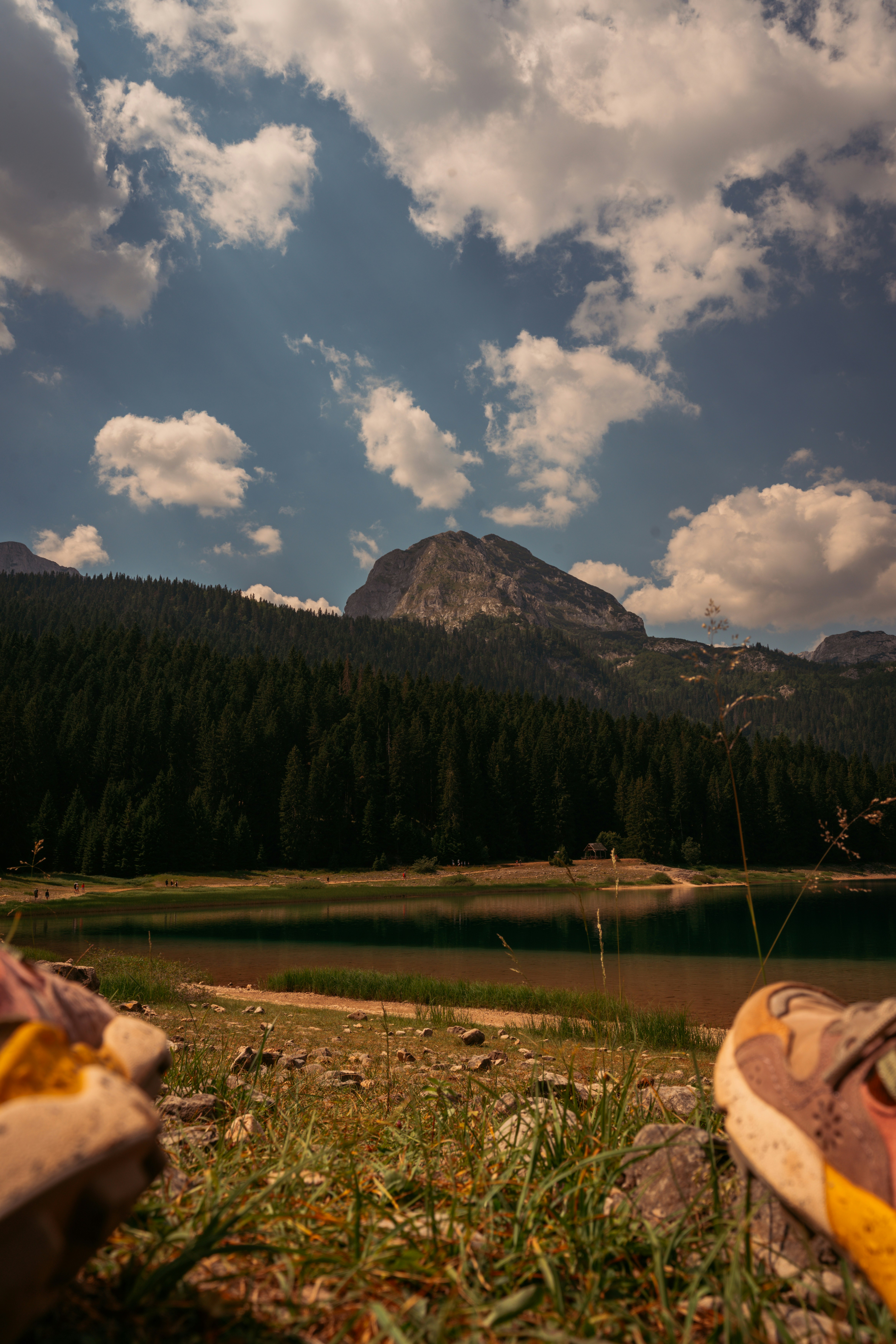 Horizon Break: Shoes at the Edge of a Mountain Lake