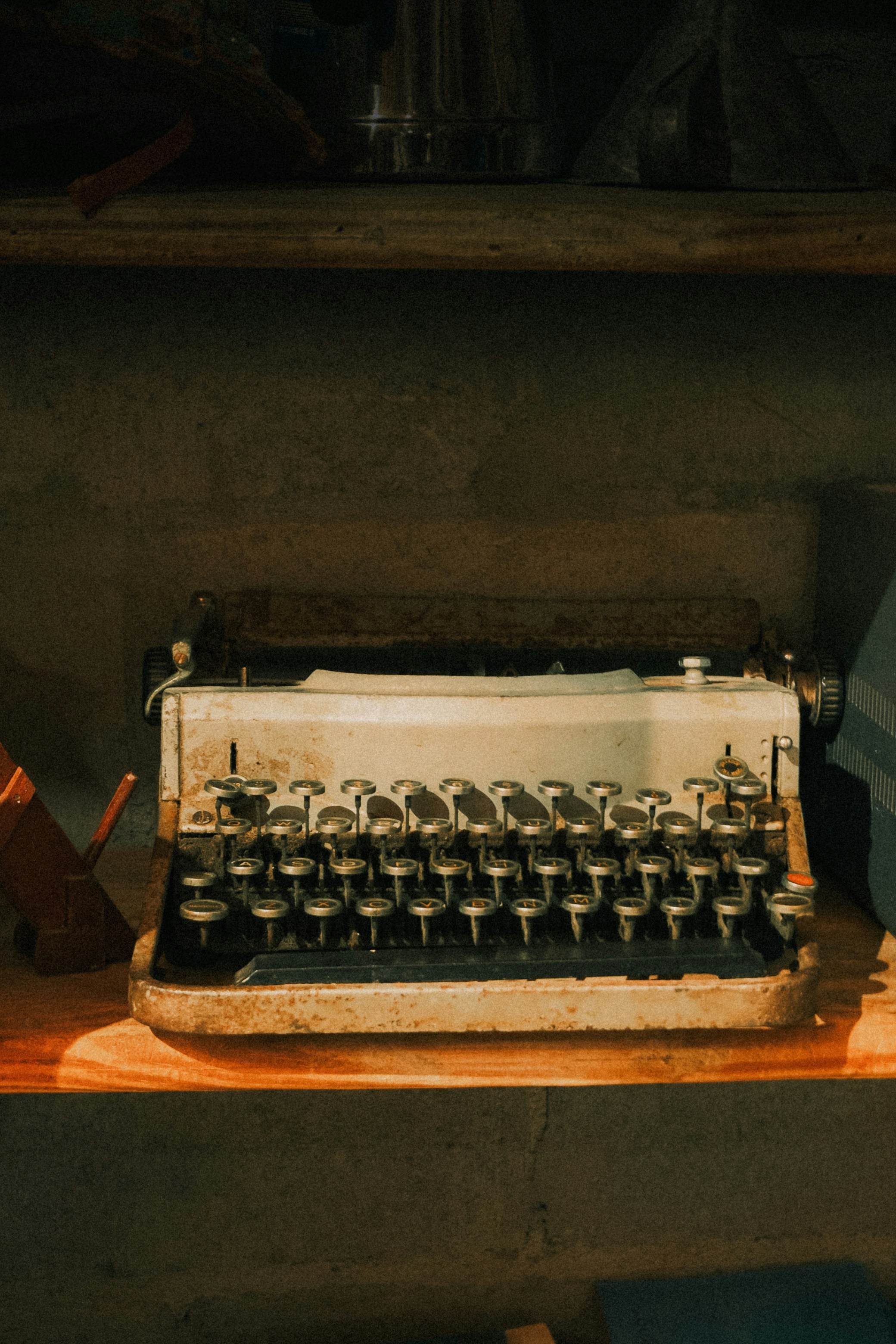 Dusty Typewriter in a Dim Workshop: Echoes of Ink and Time