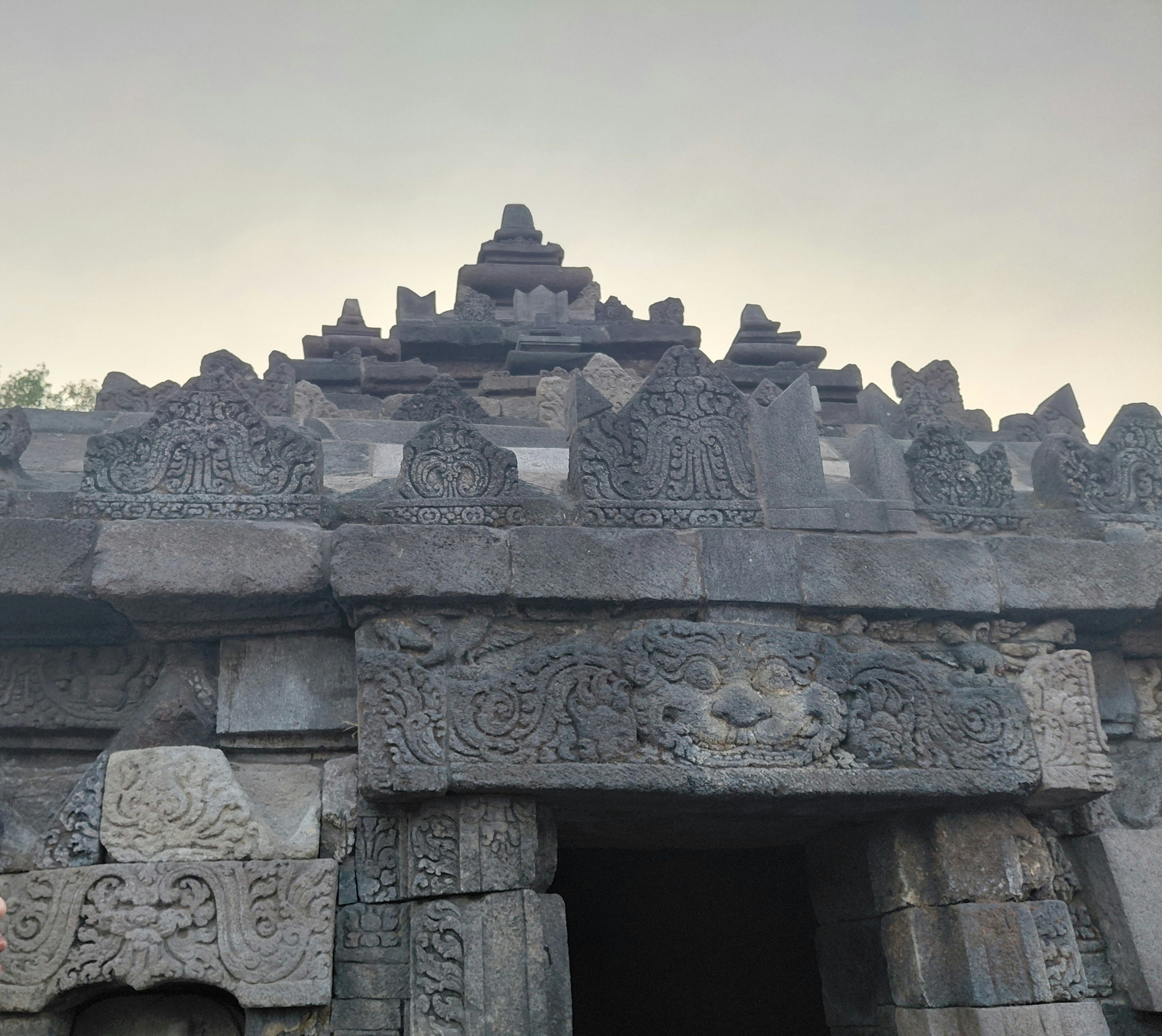 Stone Carvings Crown a Sunset-Softened Temple Facade