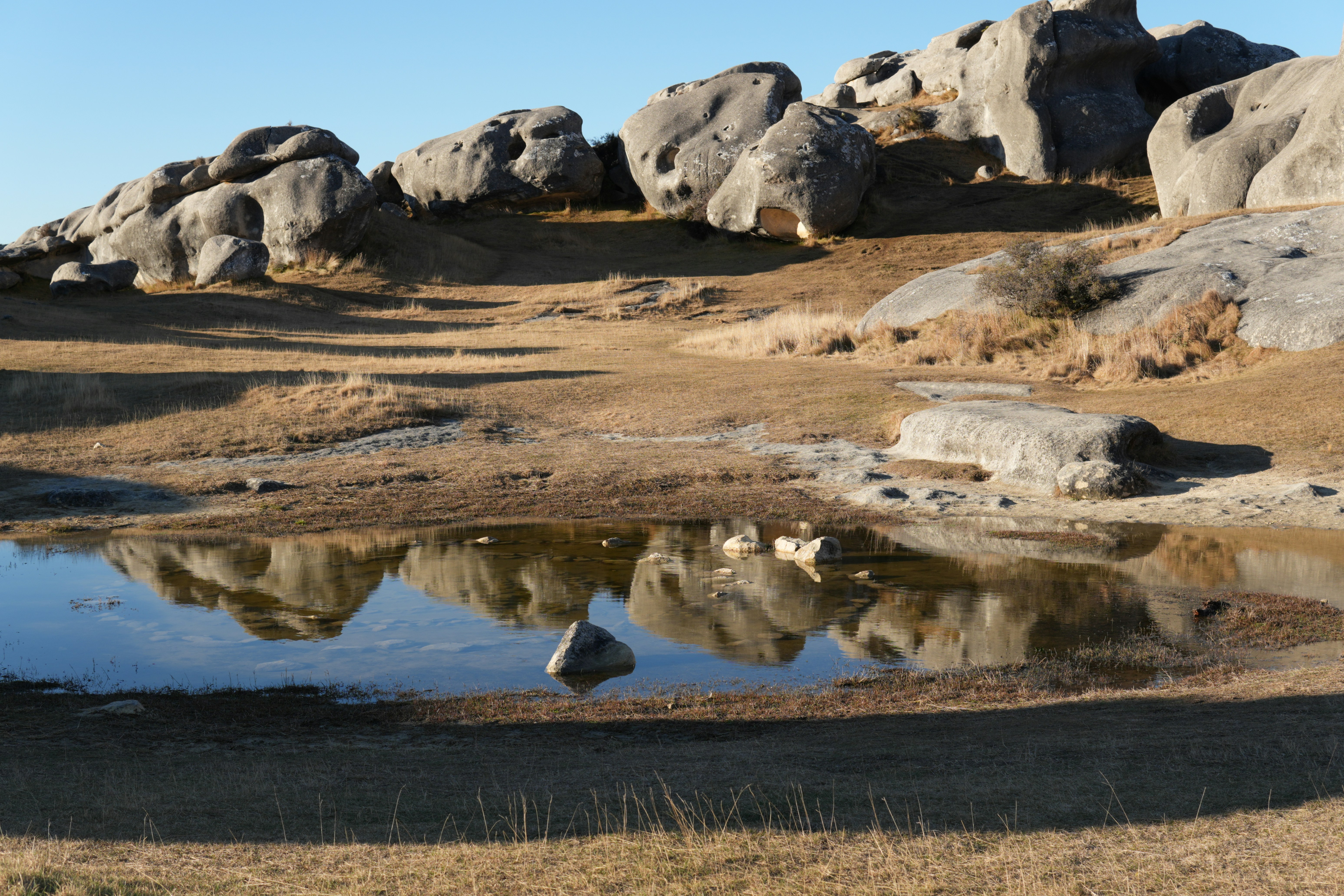 Stone Sea: Reflections and rolling boulders at golden hour
