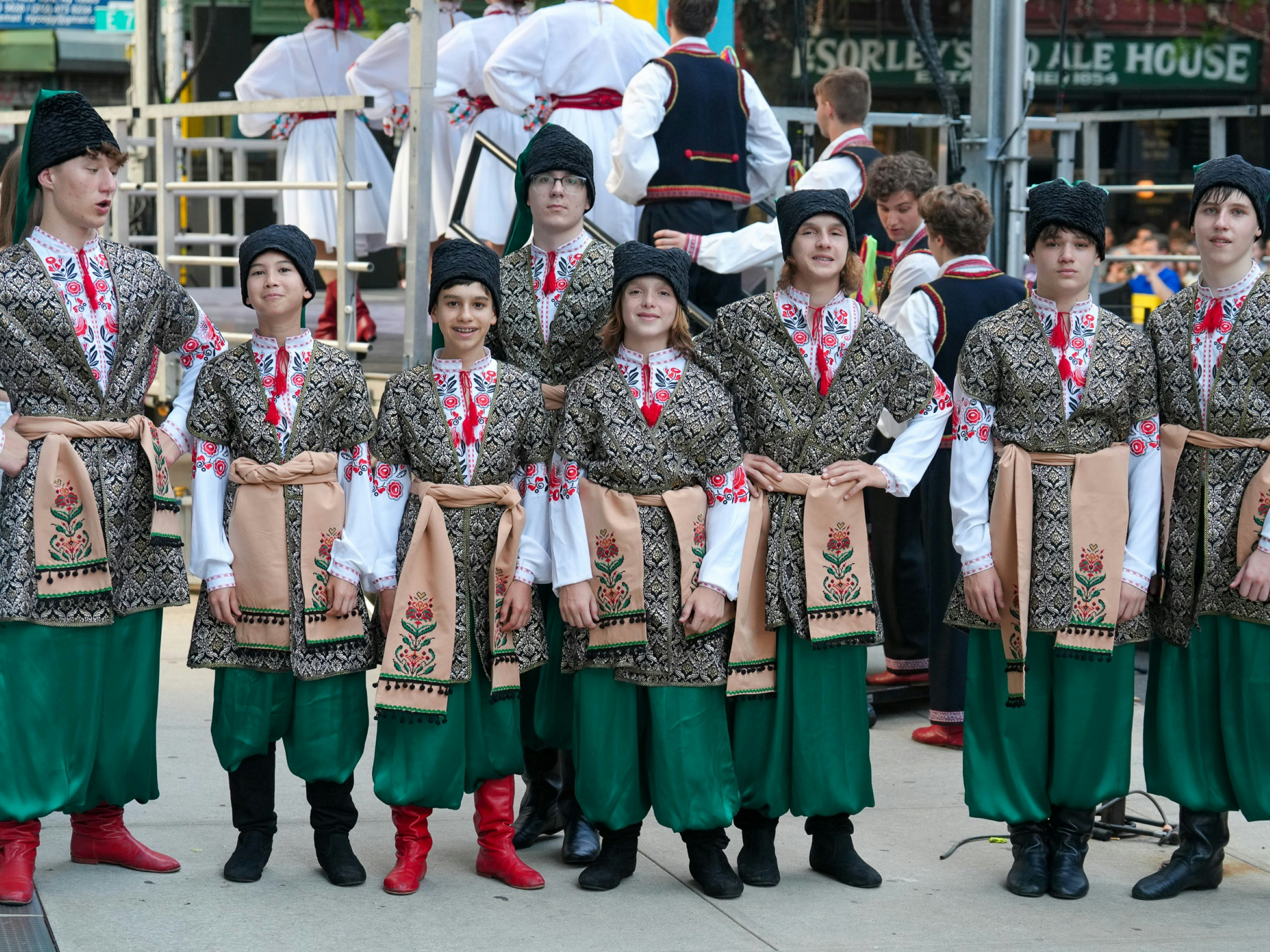 Traditional Parade Ensemble in Coordinated Garb on a Bright Street