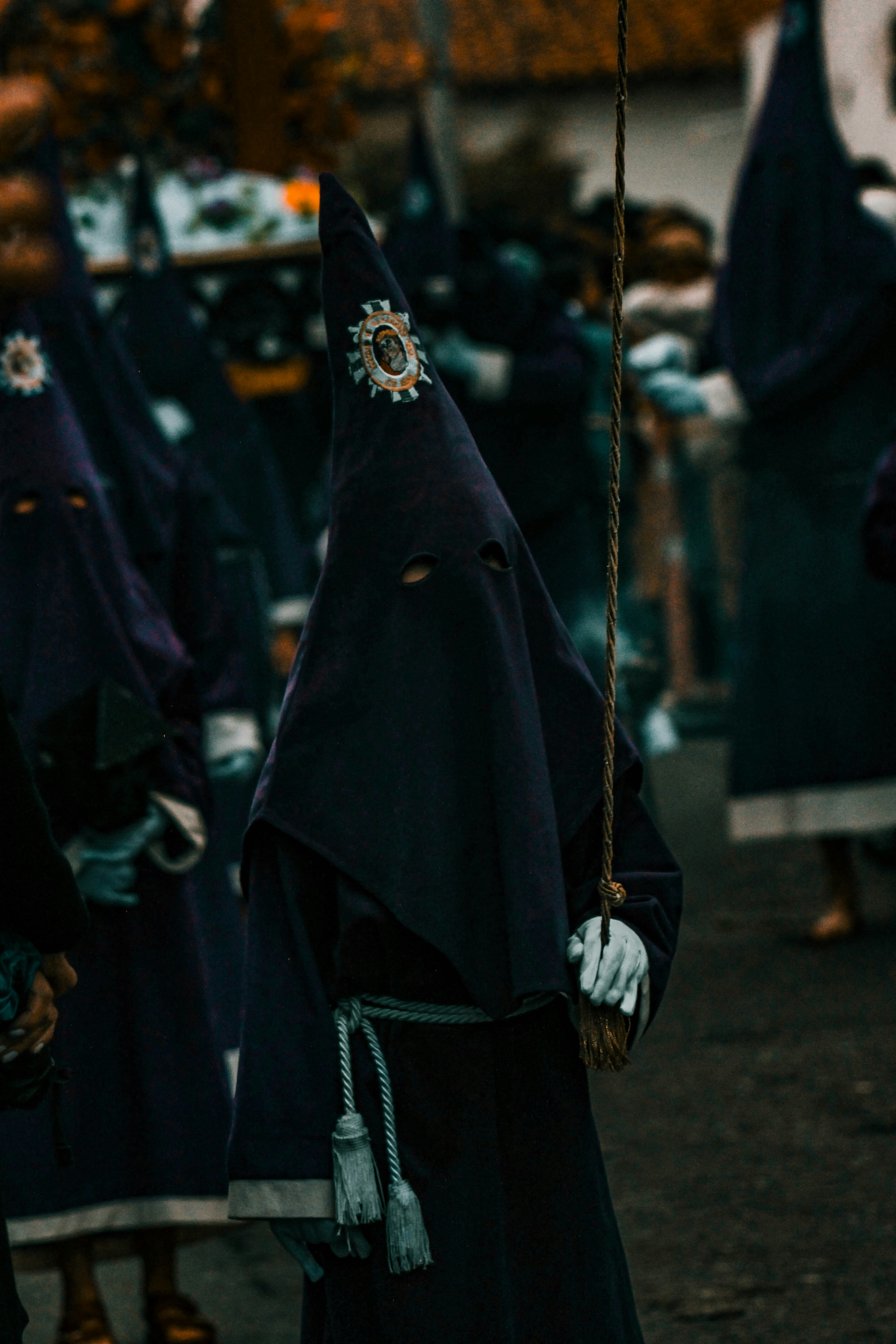 The Silent Bell Riser: A Veiled Figure in Midnight Robes