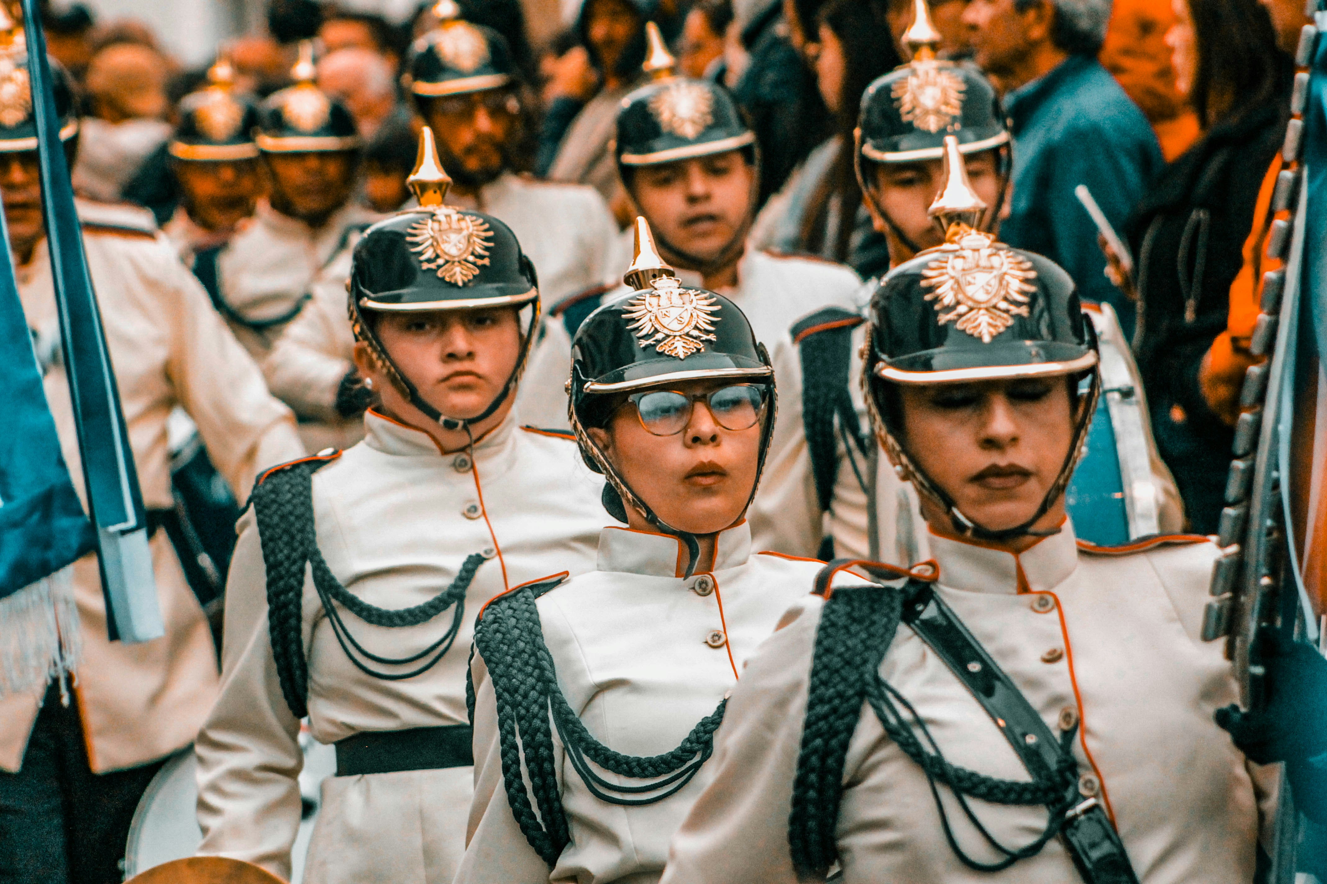 Frontline Cadence: The line of ceremonial guards marching under a watchful crowd