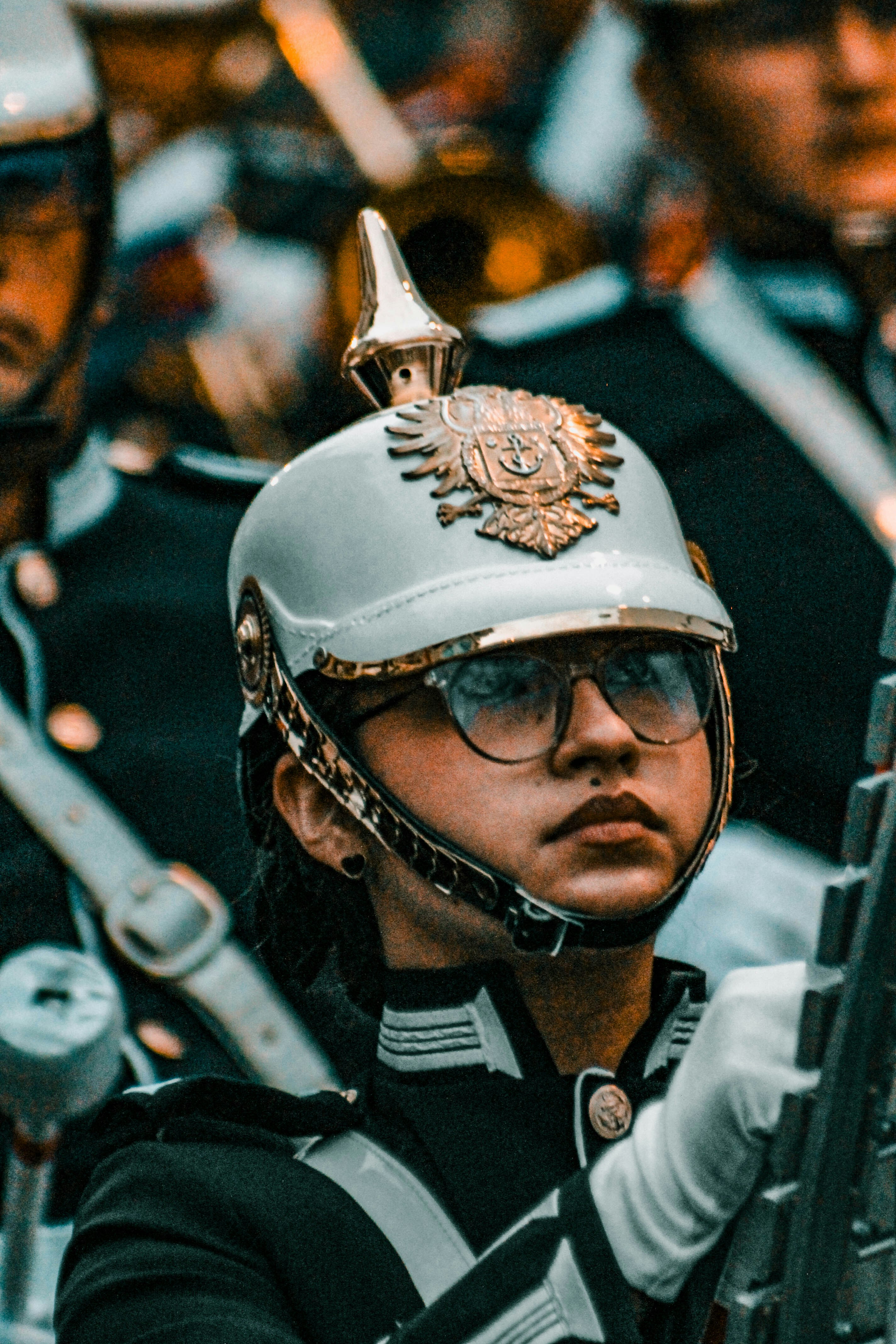 Guard in Focus: A ceremonial officer with gleaming helmet under studio-like depth