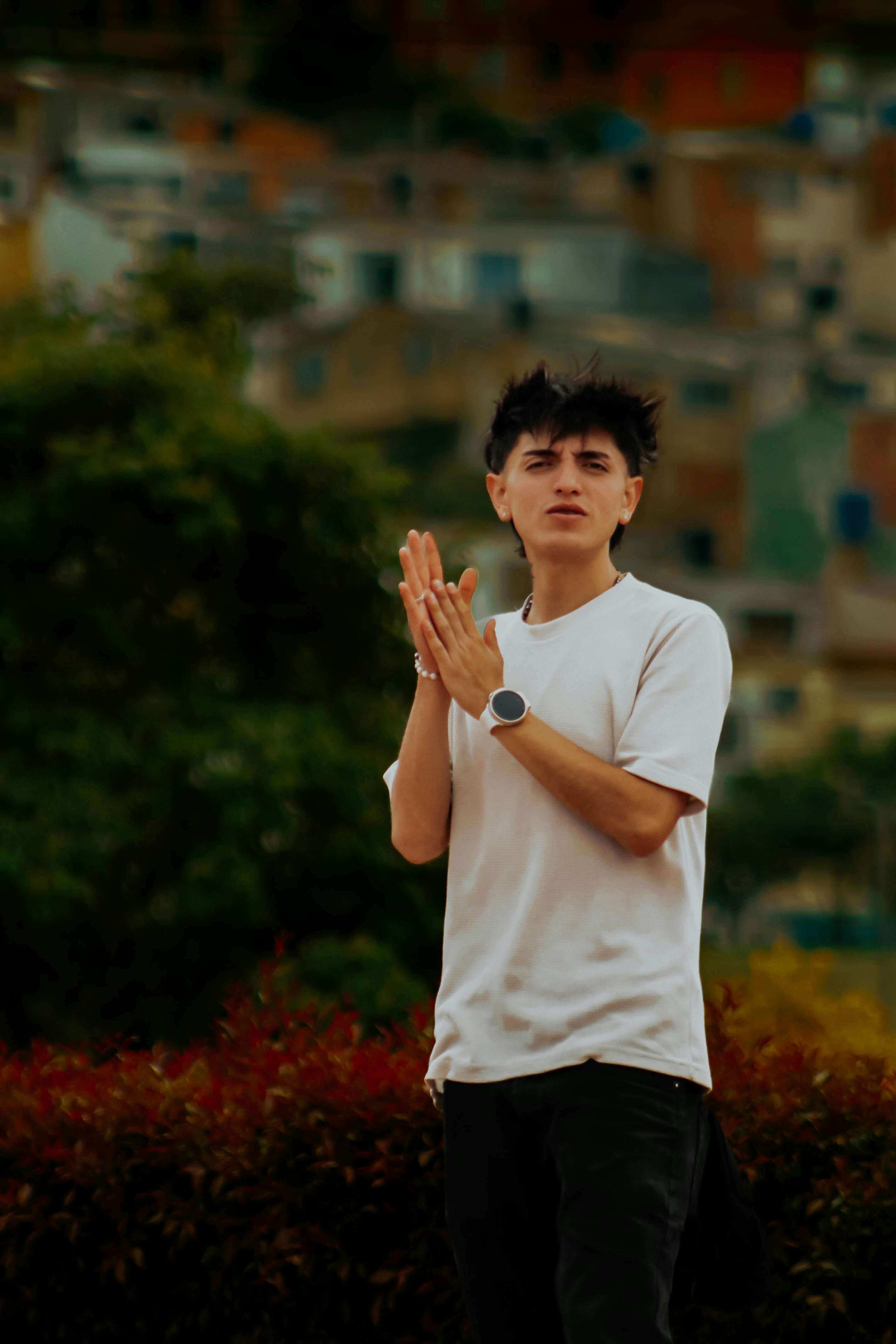 Urban Prayer: The Clasp of Hands Against a Mountain Backdrop