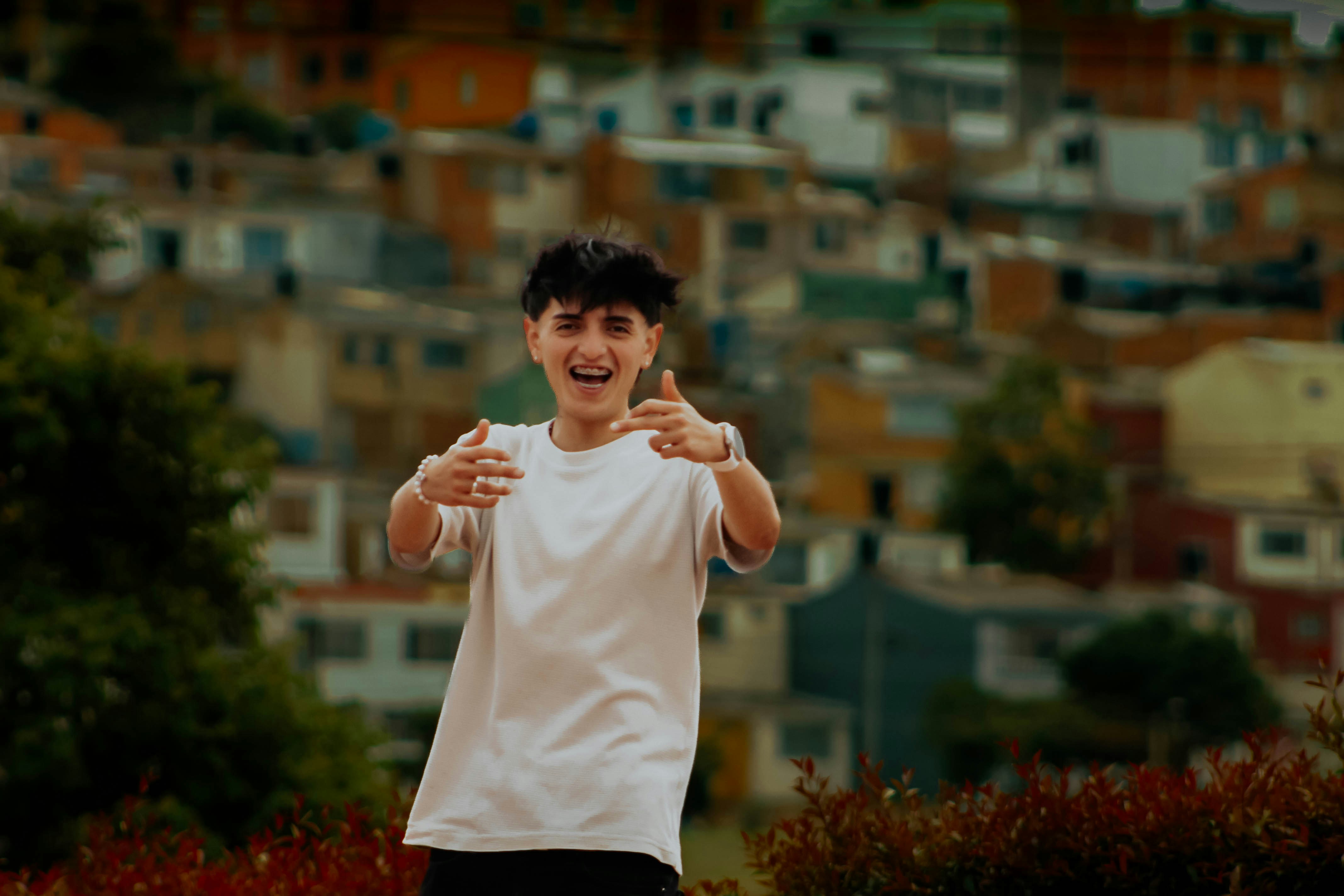 Joyful Gesture Against a Patchwork Cityscape