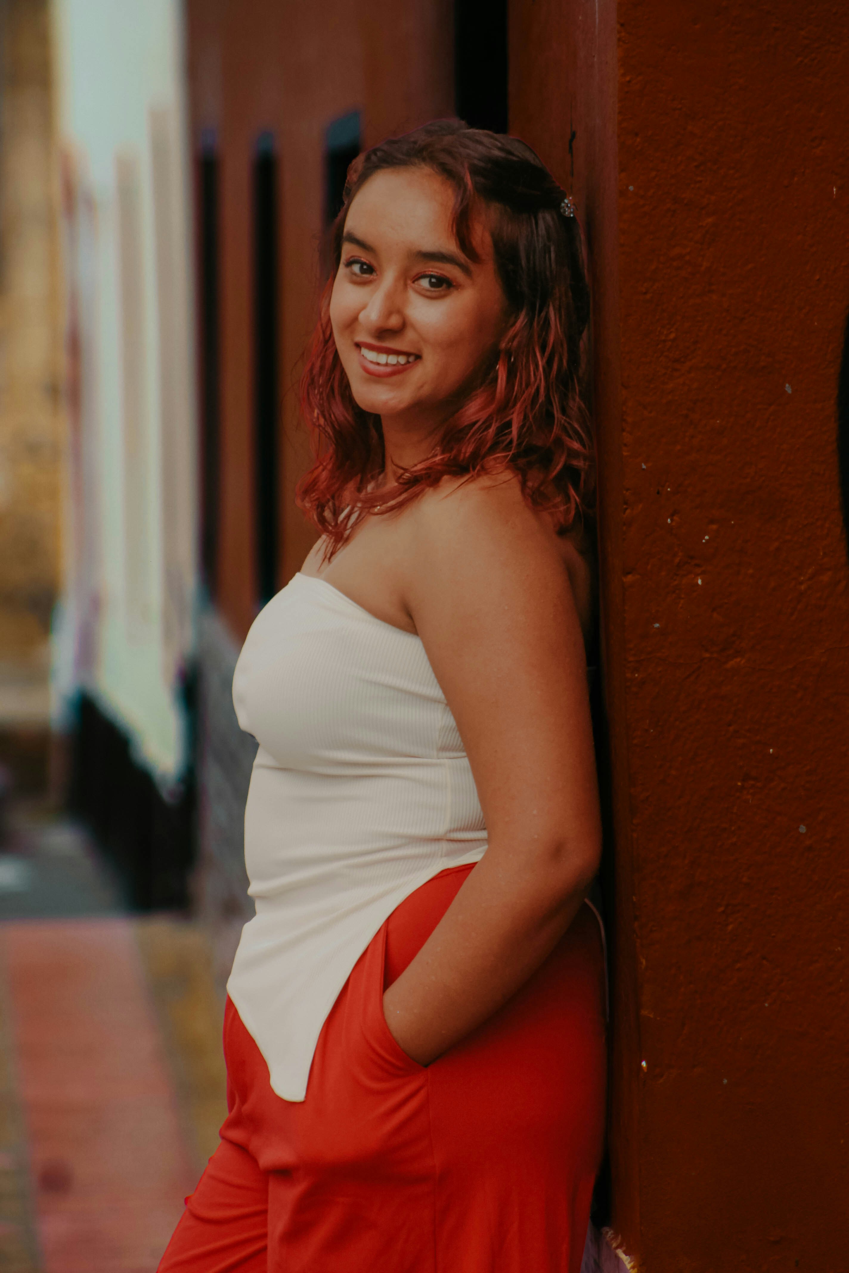 Leaned Against Rust: A Portrait in Warm Street Light