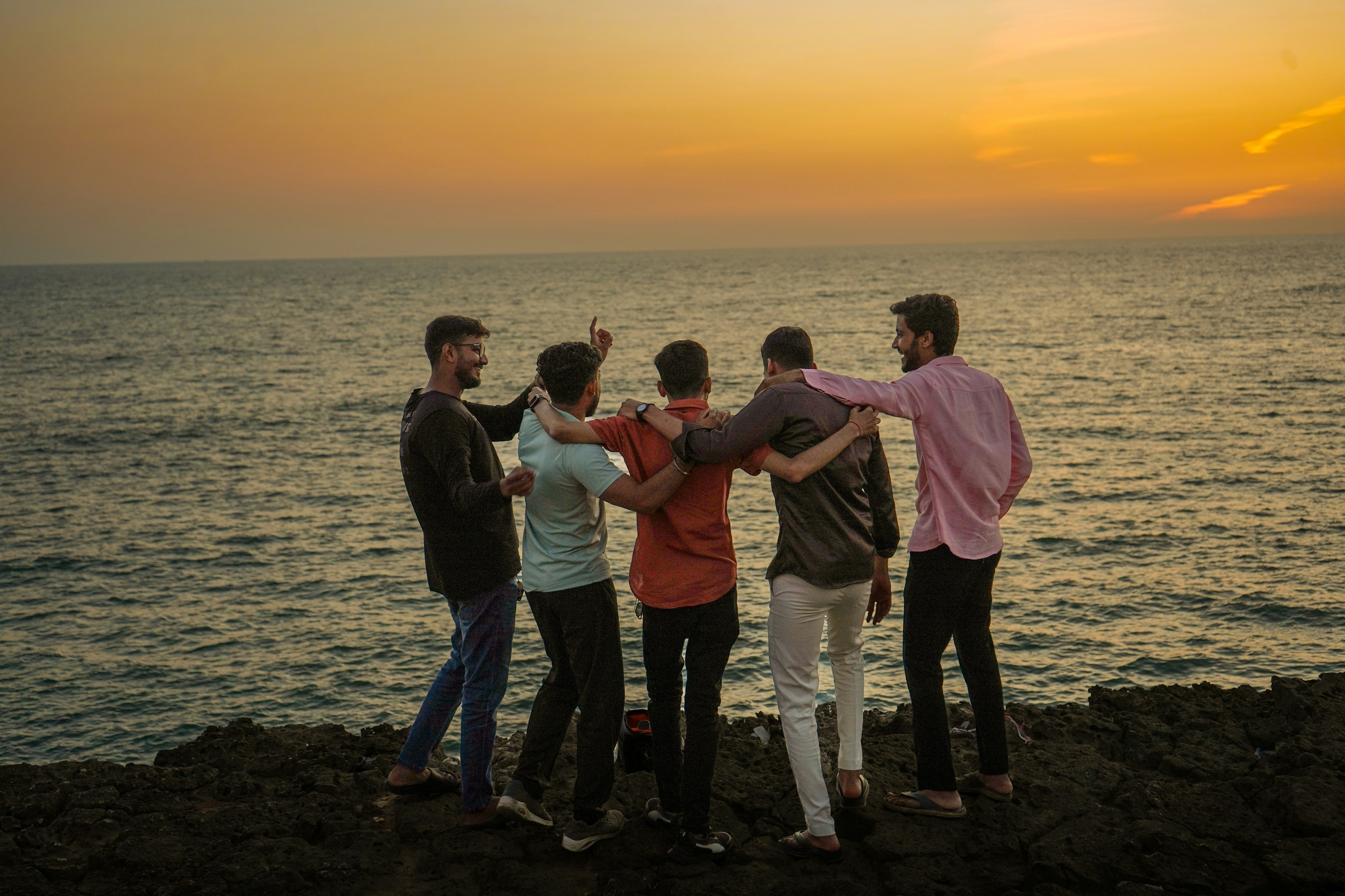 Horizon of Friendship: A Sunset Circle on the Clifftop
