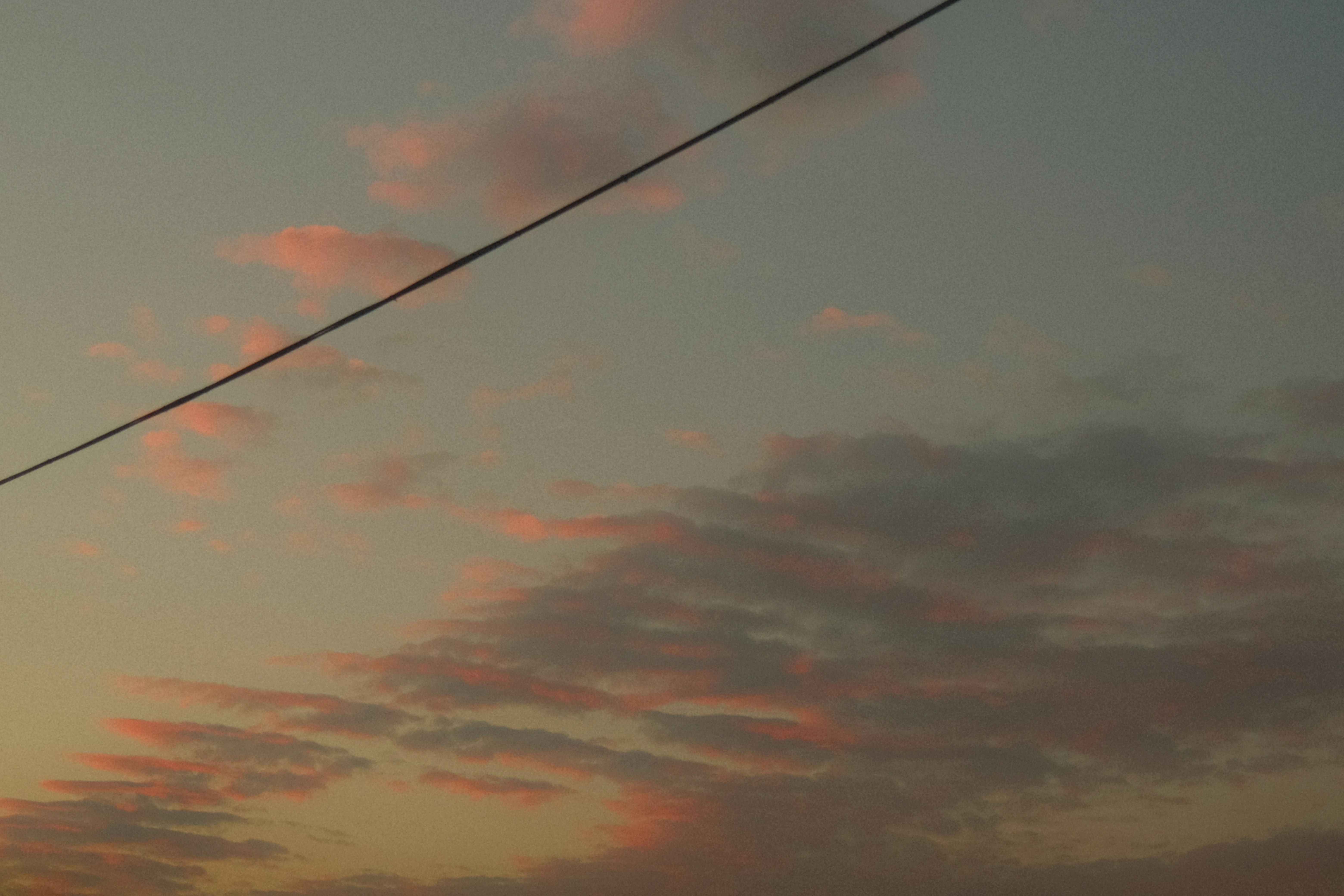 Wisp of Sky Overhead: A Quiet Sunset with a Diagonal Wire