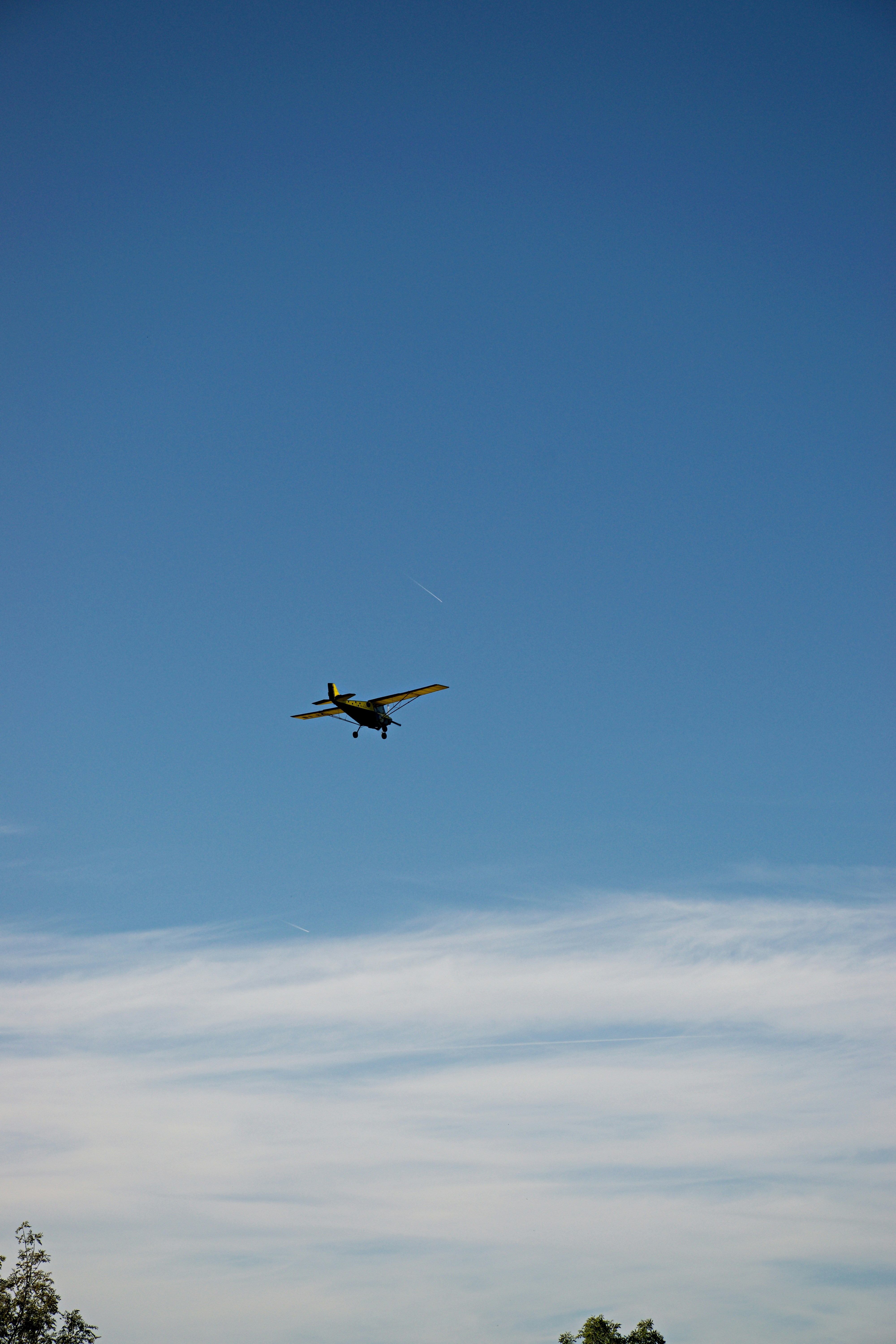 Solo Crawler: A Small Plane Drawn Against a Vast Sky