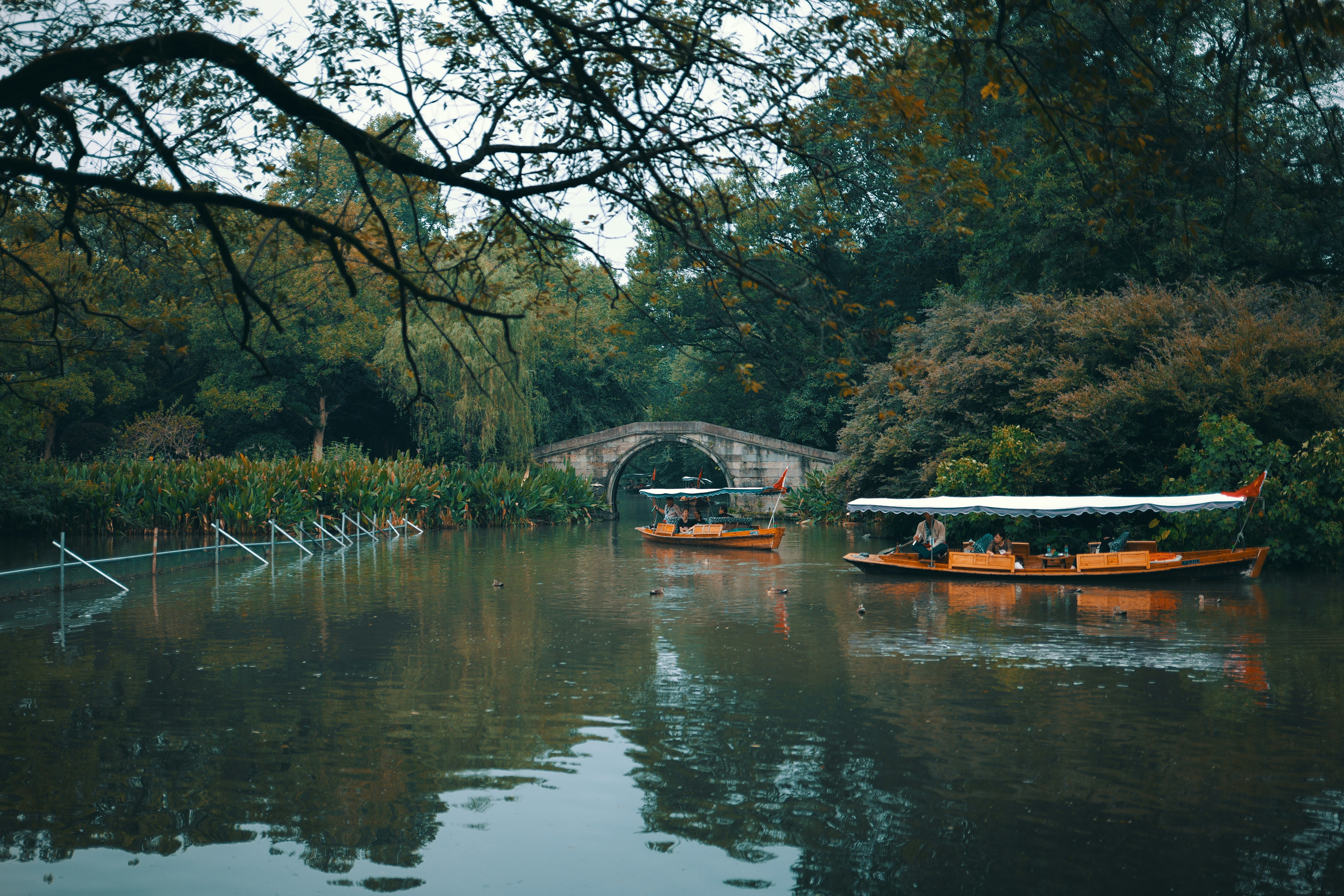 Boat Parade Under the Arched Bridge