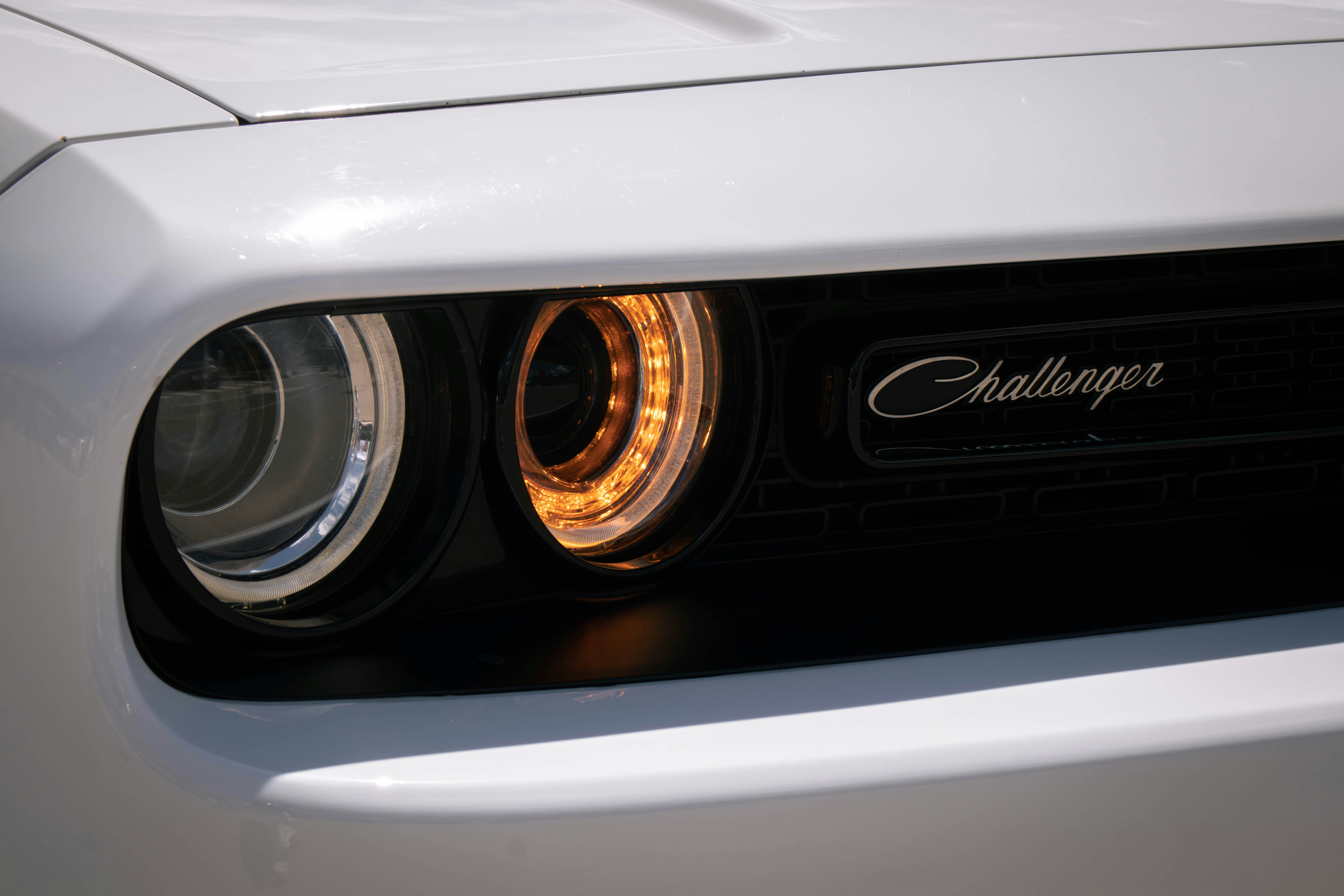 Challenger’s Glowing Halo: A Classic Muscle Car’s Front Portrait