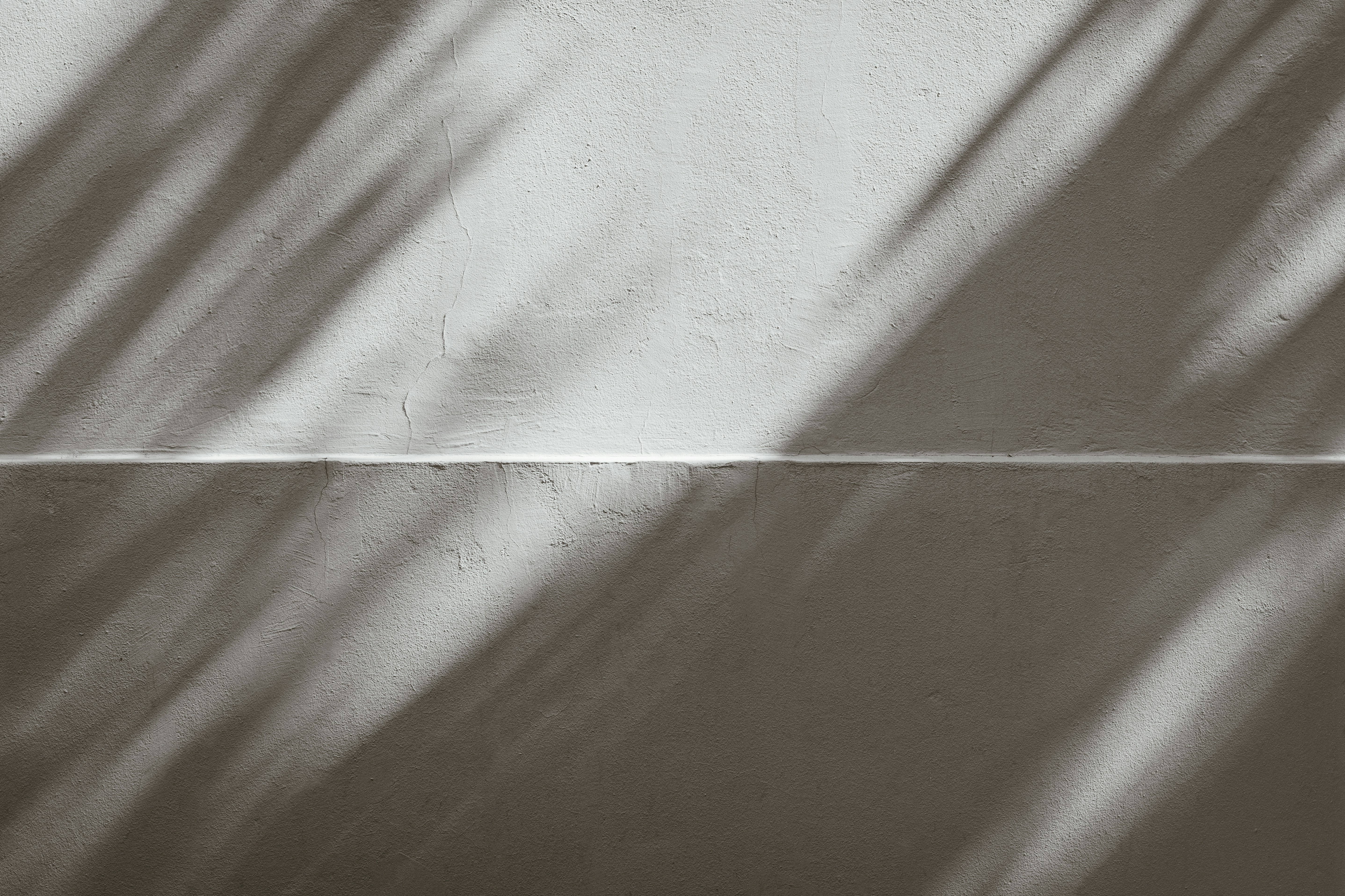 Diagonal Shadows on a Textured Concrete Wall