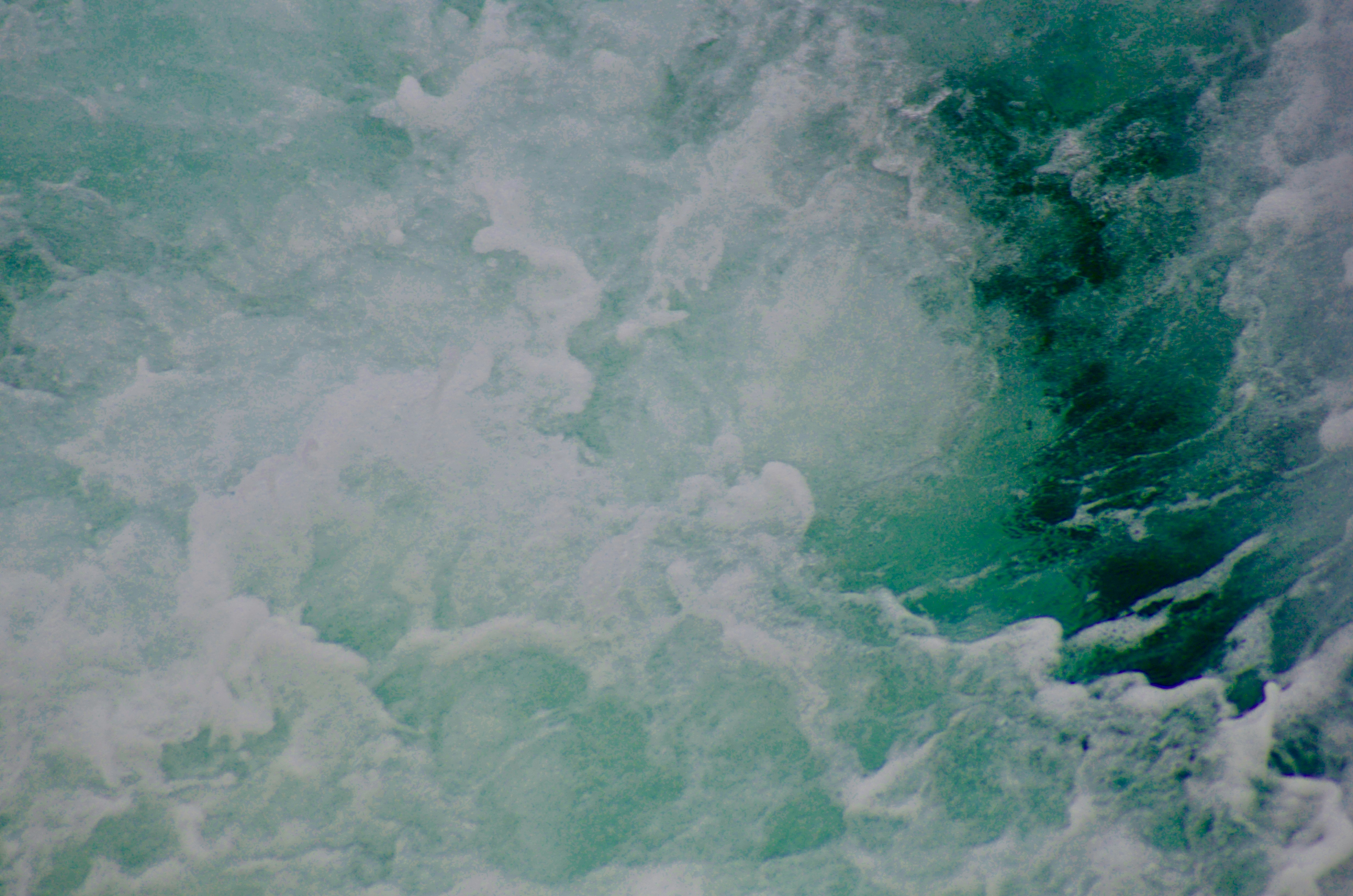 Rush of Turquoise Foam: Close-Up of Breaking Waves
