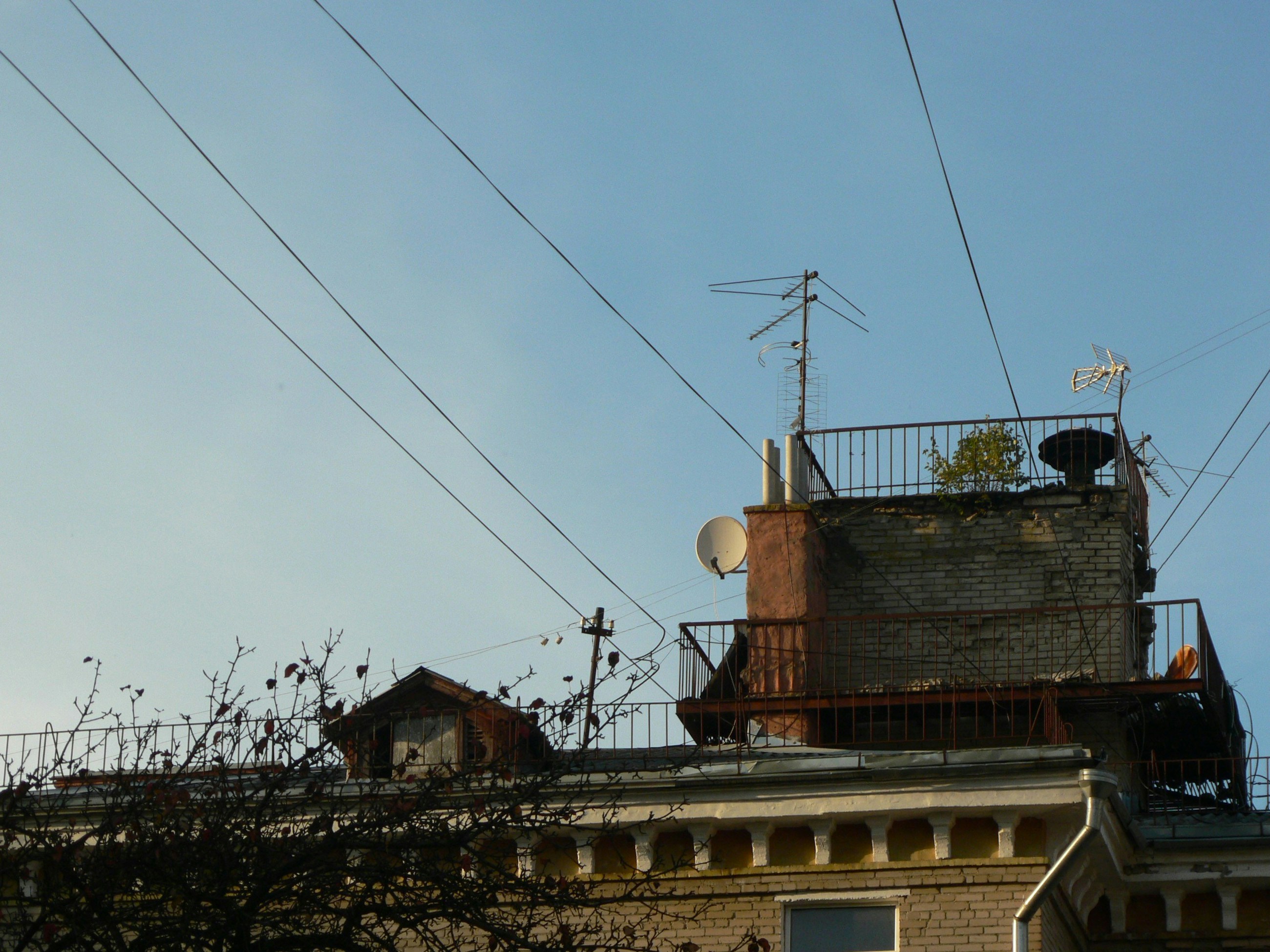 Rooftop Elements under a Pale Sky