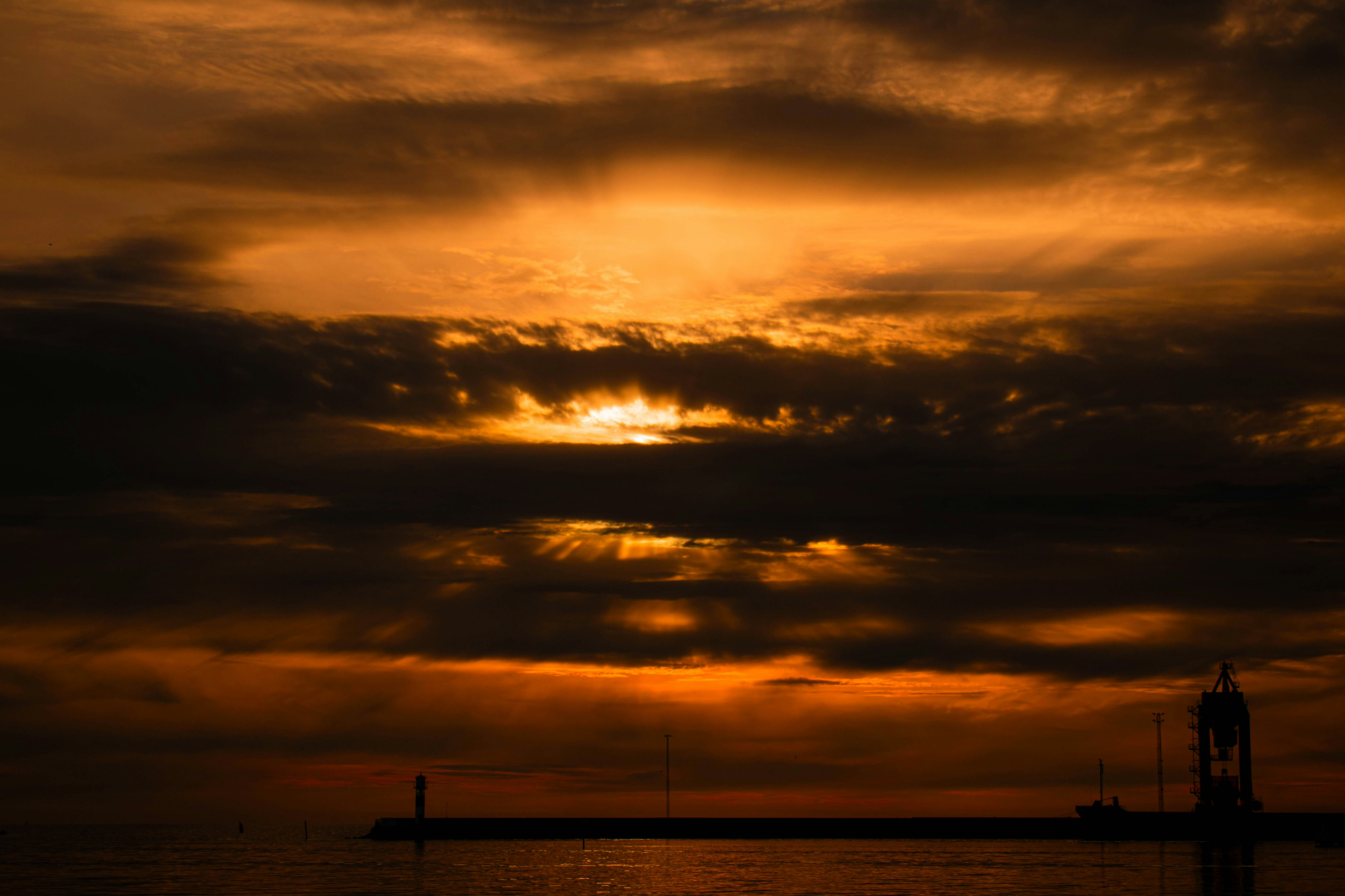Golden Silhouette at Dusk: Pier and Sky